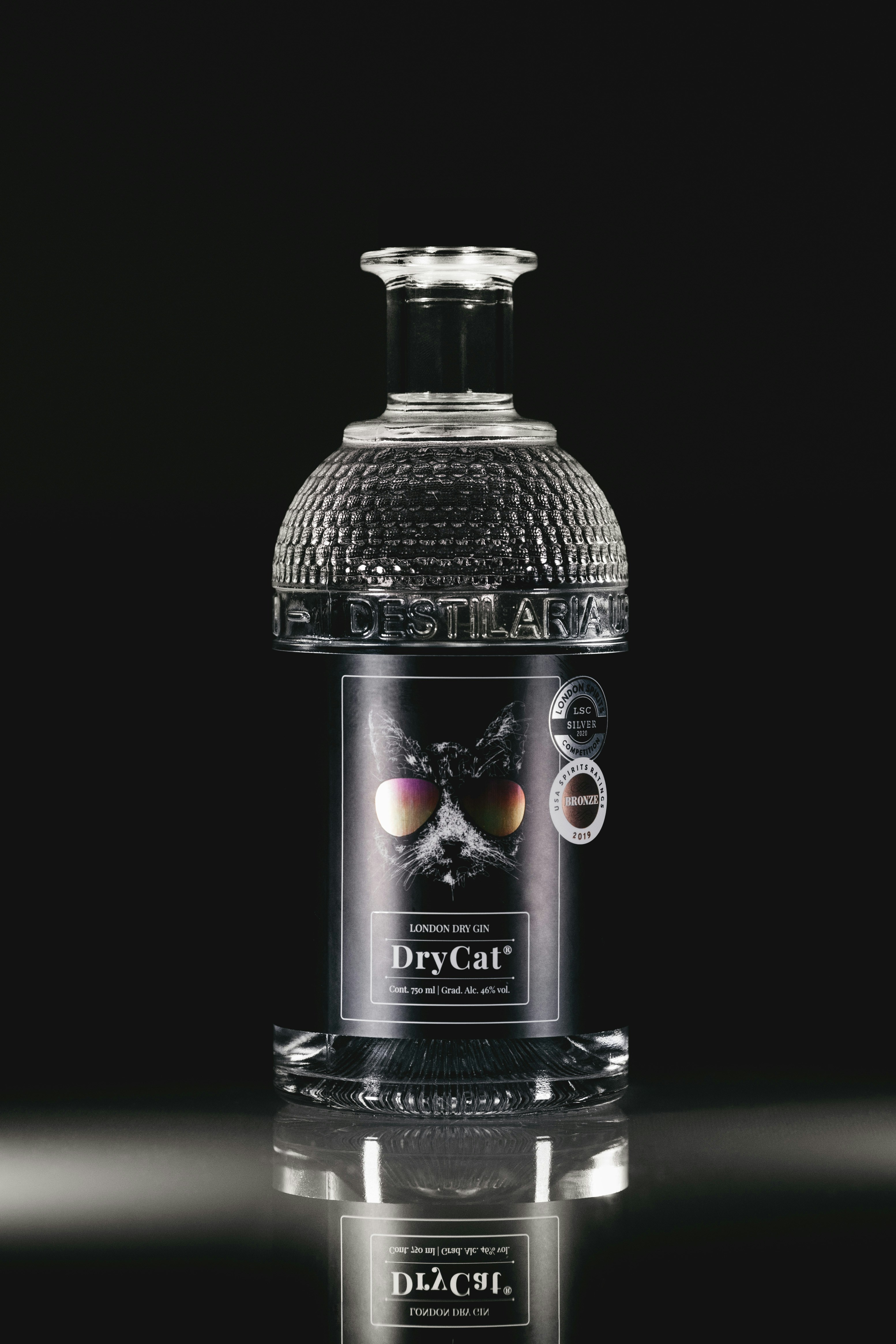 Glassy Distinction: A Single-Bottle Portrait in Velvet Darkness