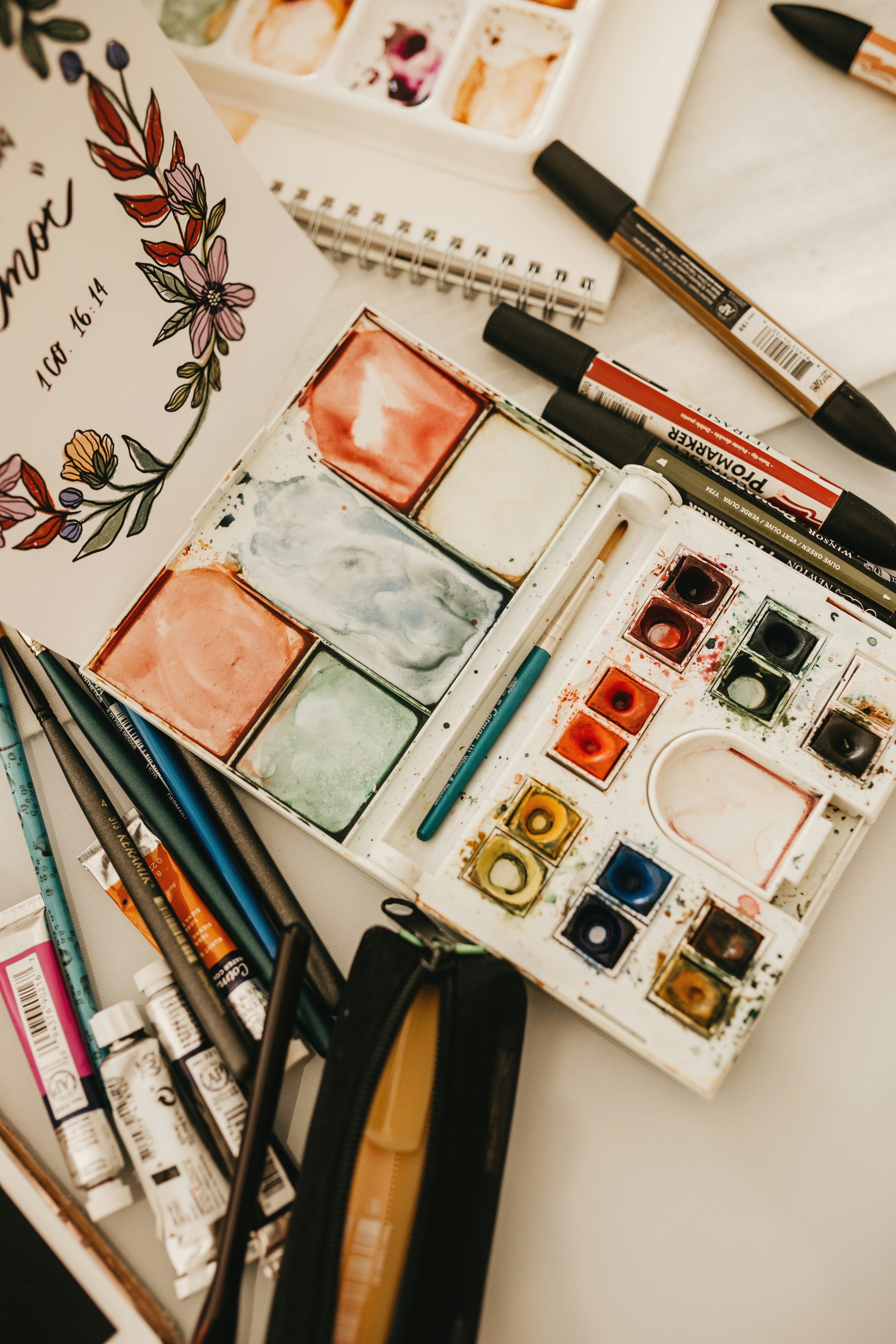 A table topped with lots of art supplies photo – Free Paint container ...