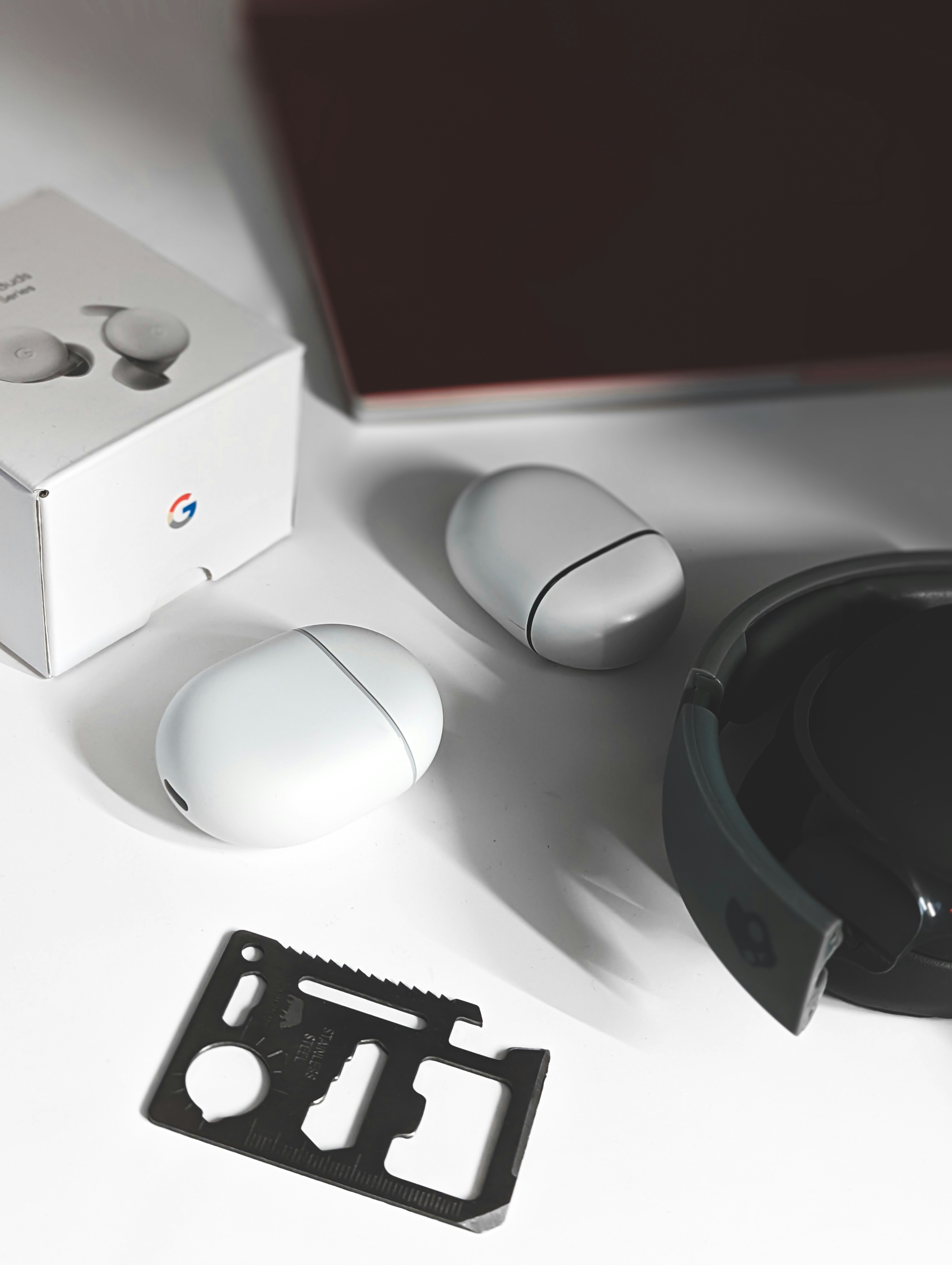 Unboxing Essentials: Pixel-perfect Earbuds and Accessories on a Clean Studio Surface