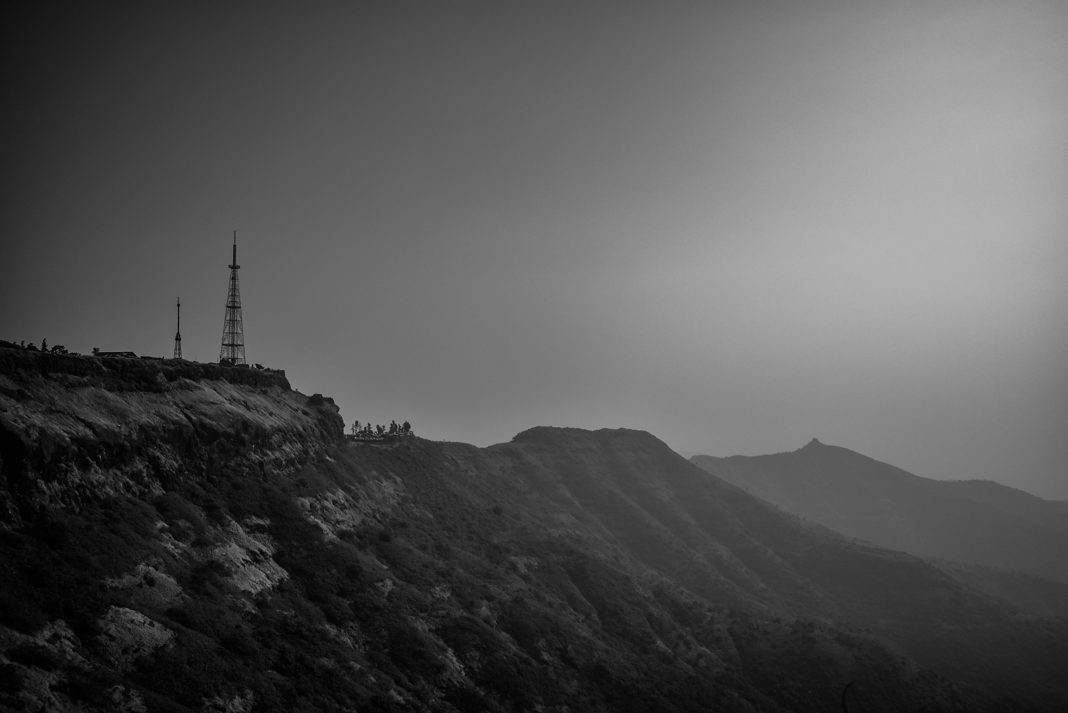 Edge of Silence: A Ridge with Distant Peaks and a Lone Communications Tower