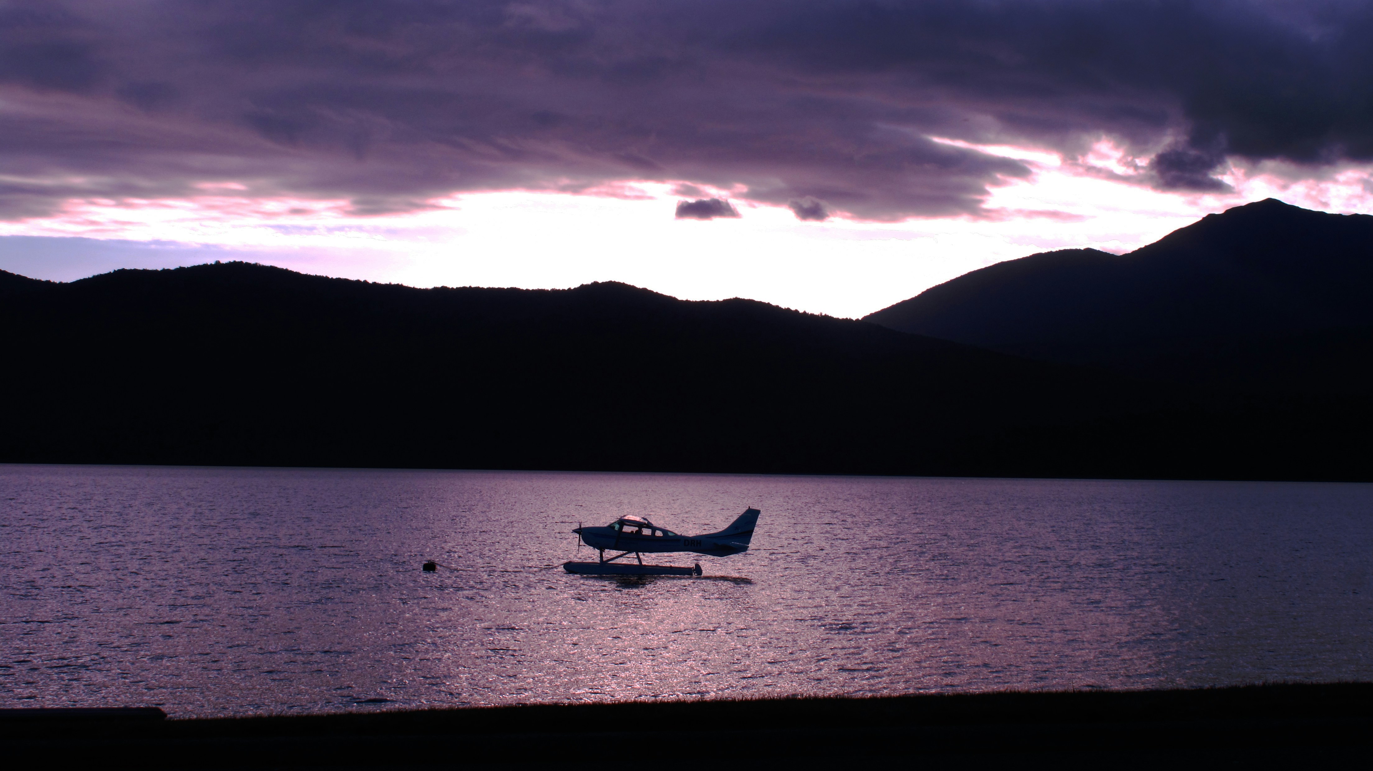 Dusk's Seaplane over a Quiet Fjord