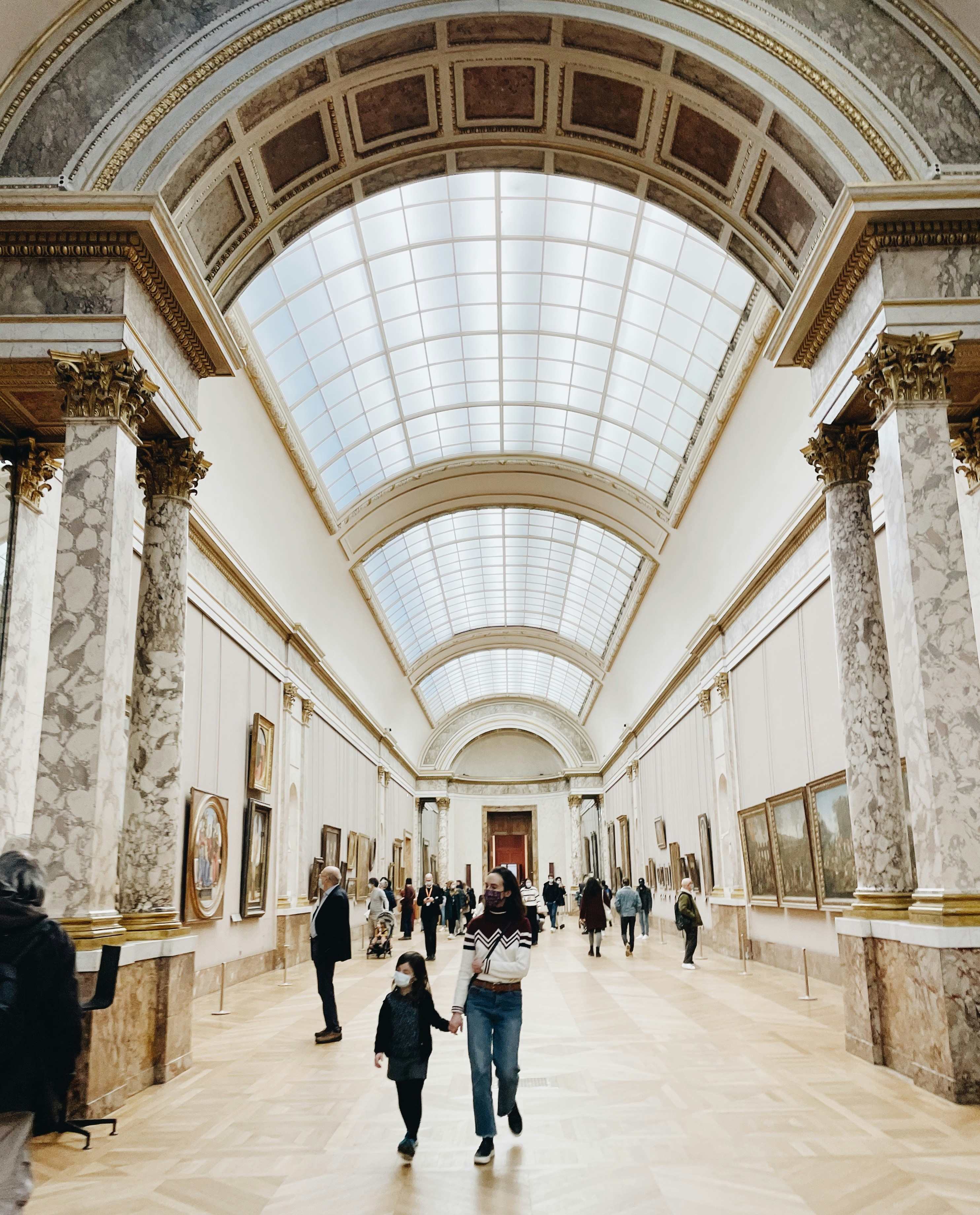 A group of people walking through a museum photo – Free Art Image on ...