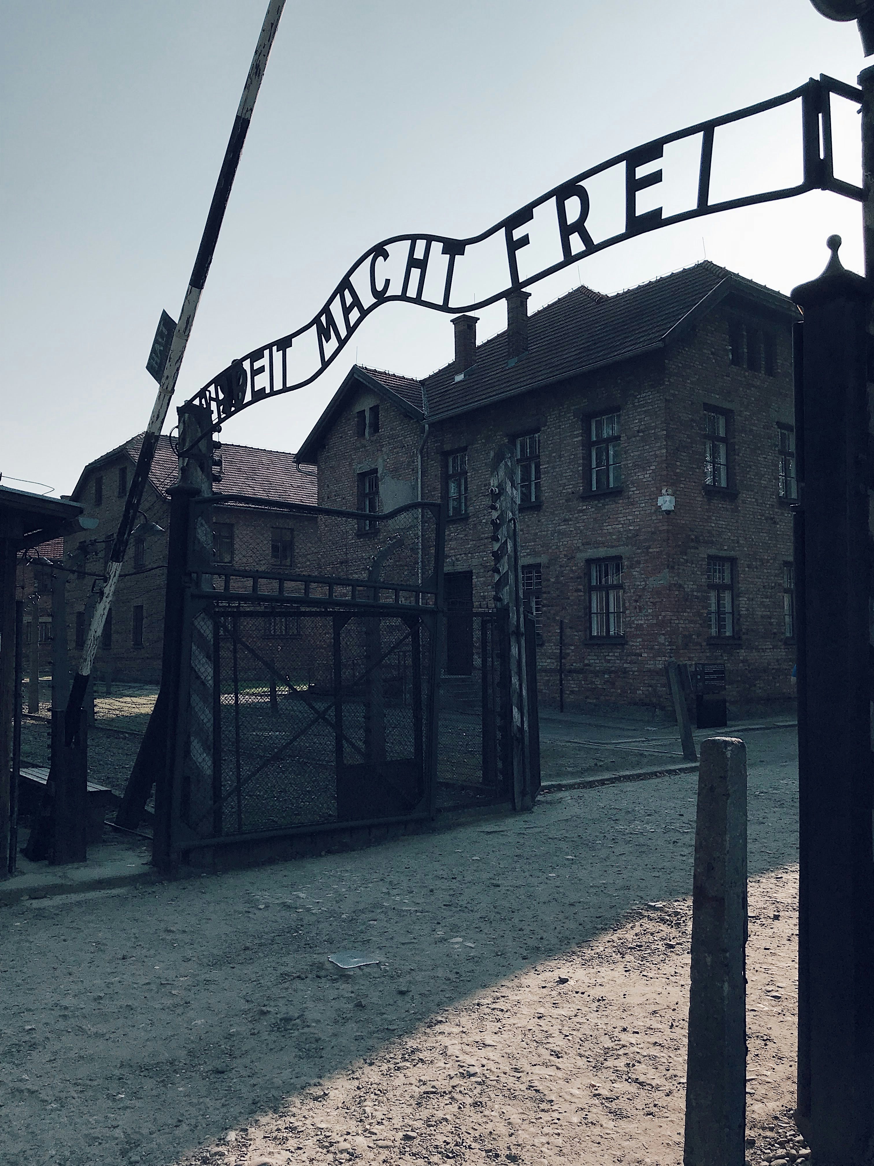 Arbeit Macht Frei Gate: Weathered Arch Over Brick Buildings