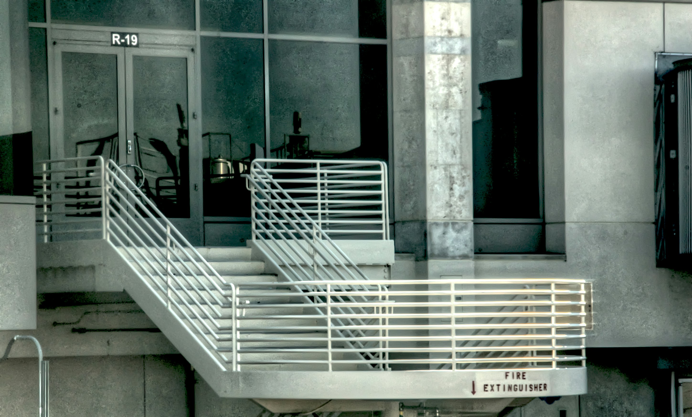 A building with a metal railing and a clock on it photo – Free White ...