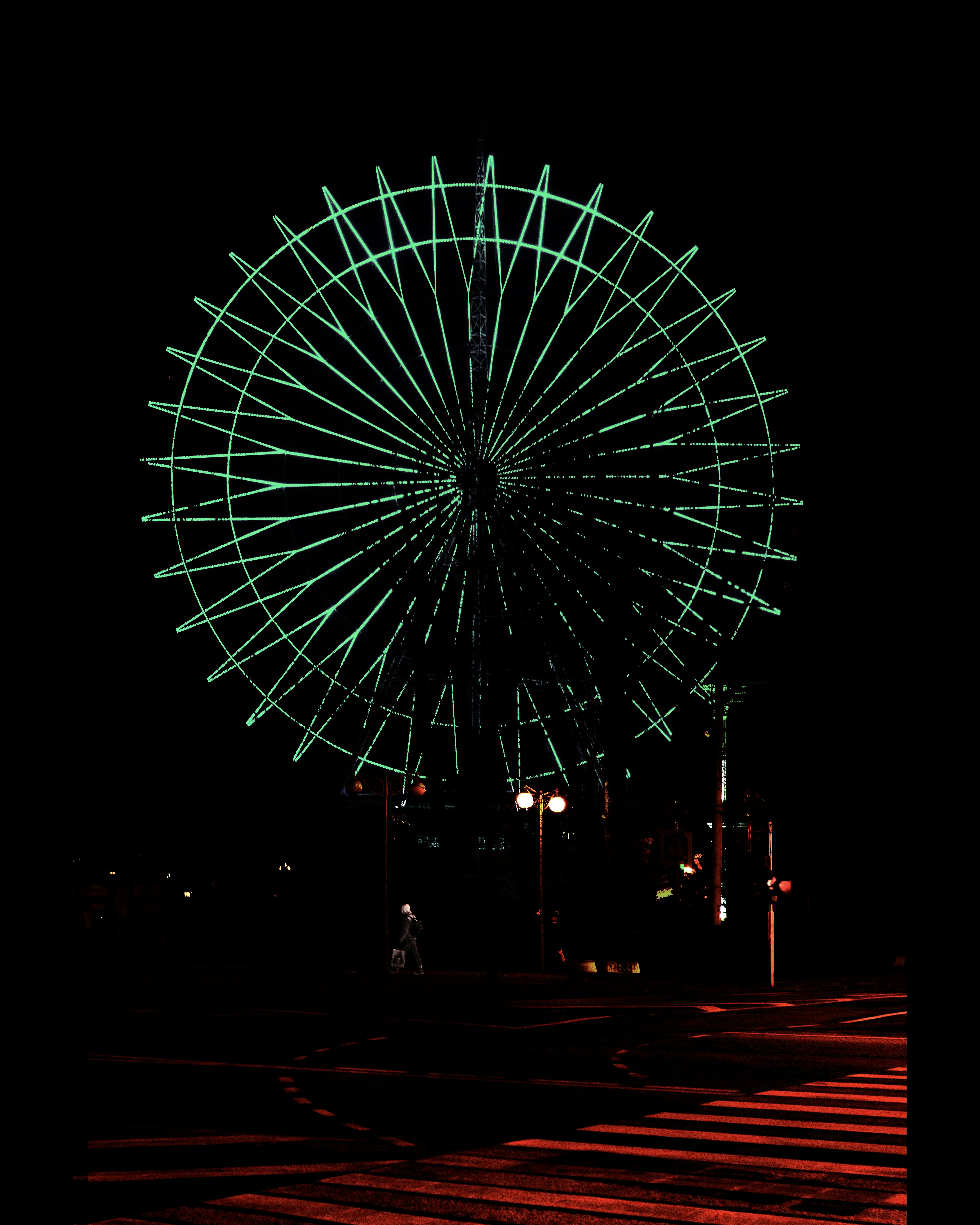 Luminous Spokes: Neon Ferris Wheel Illuminates a Quiet Night