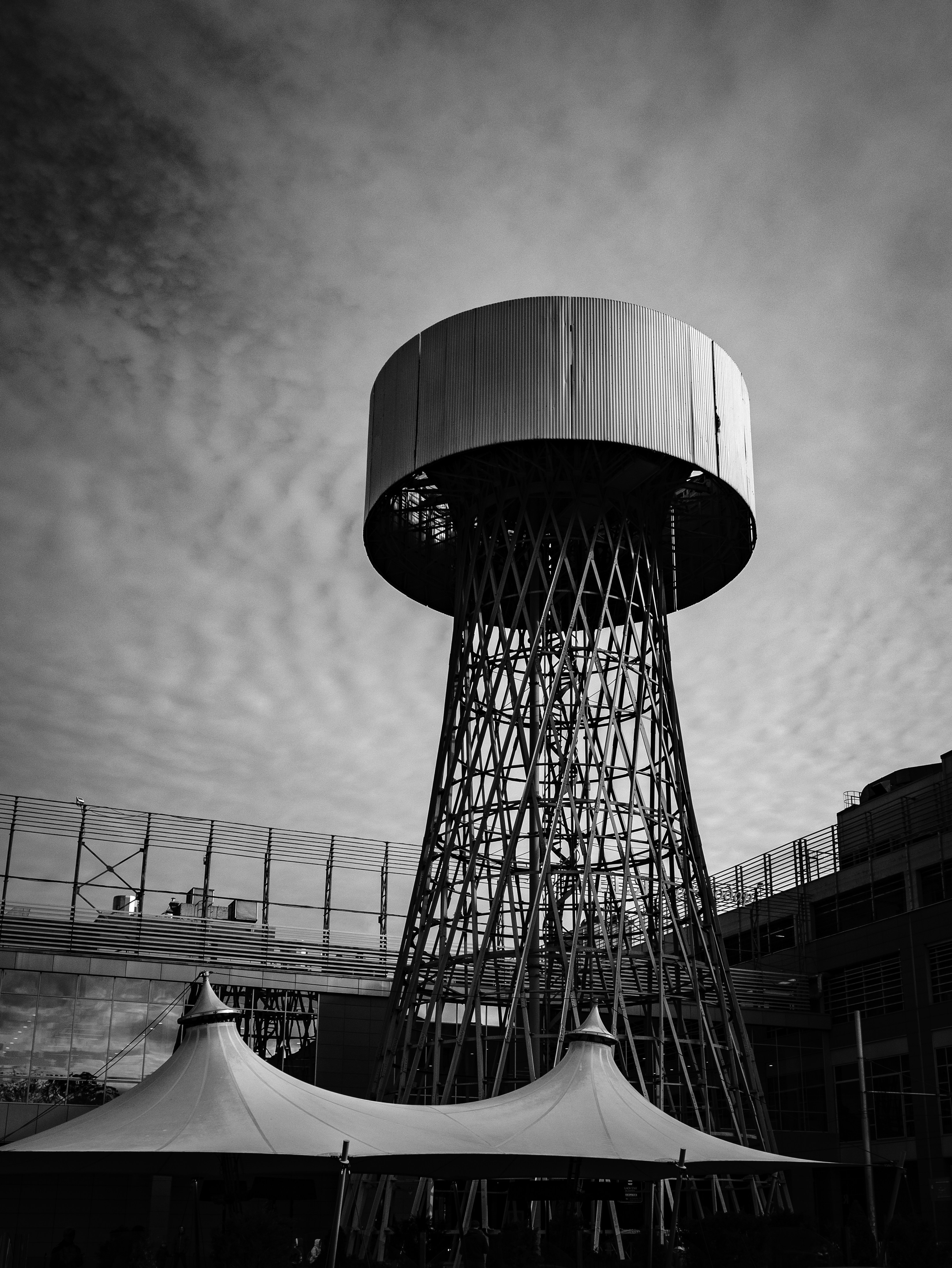 Skyward Cone: A Structural Tower Reaching Toward the Overcast