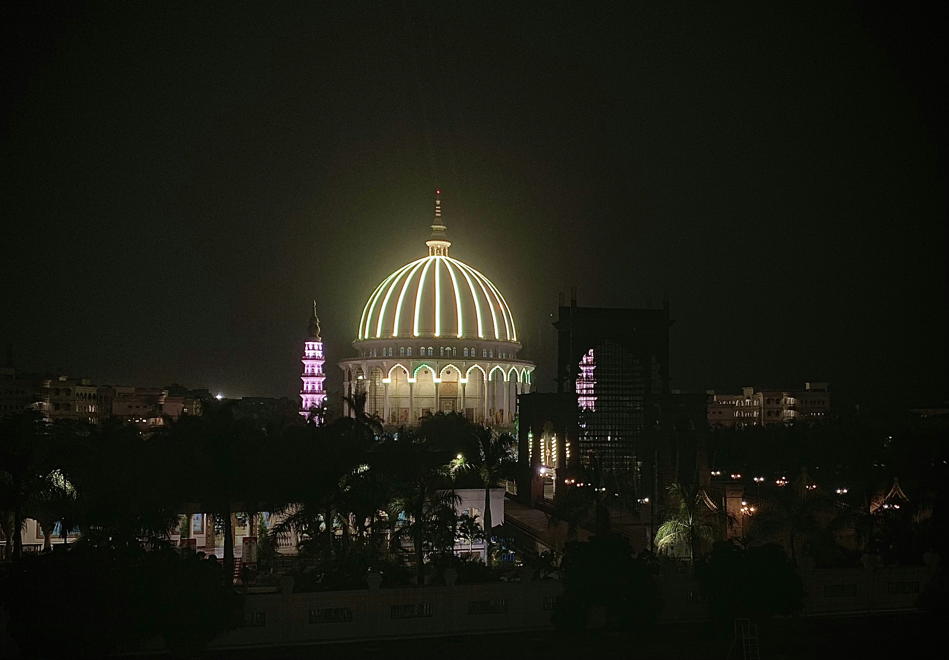 A large building with a dome lit up at night photo – Free Udaipur Image ...