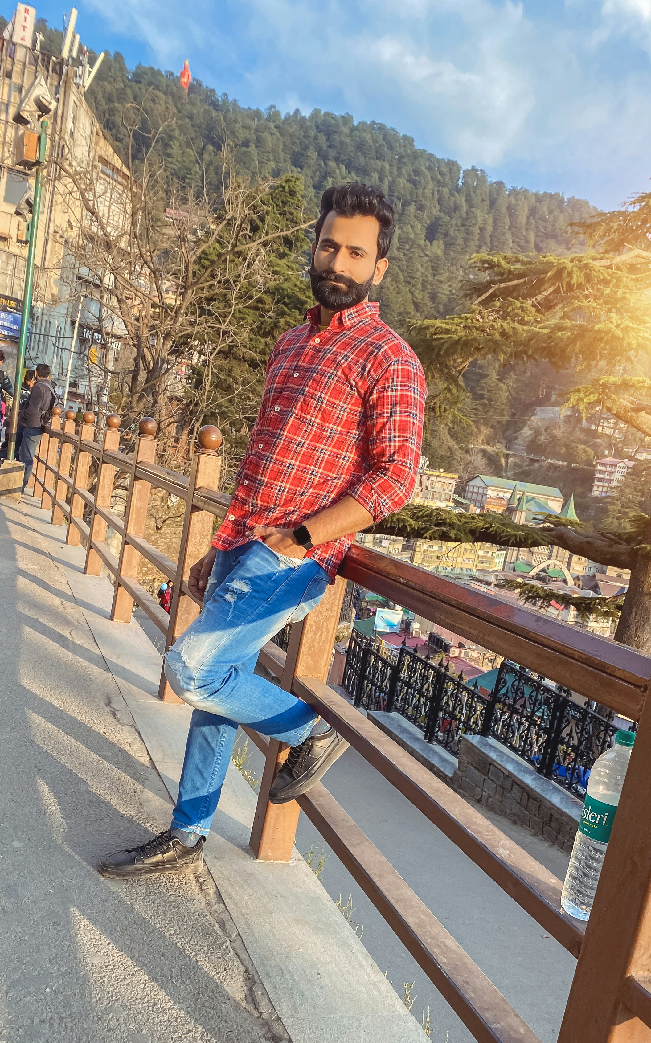 A man with a beard standing on a railing photo – Free Shimla Image on ...
