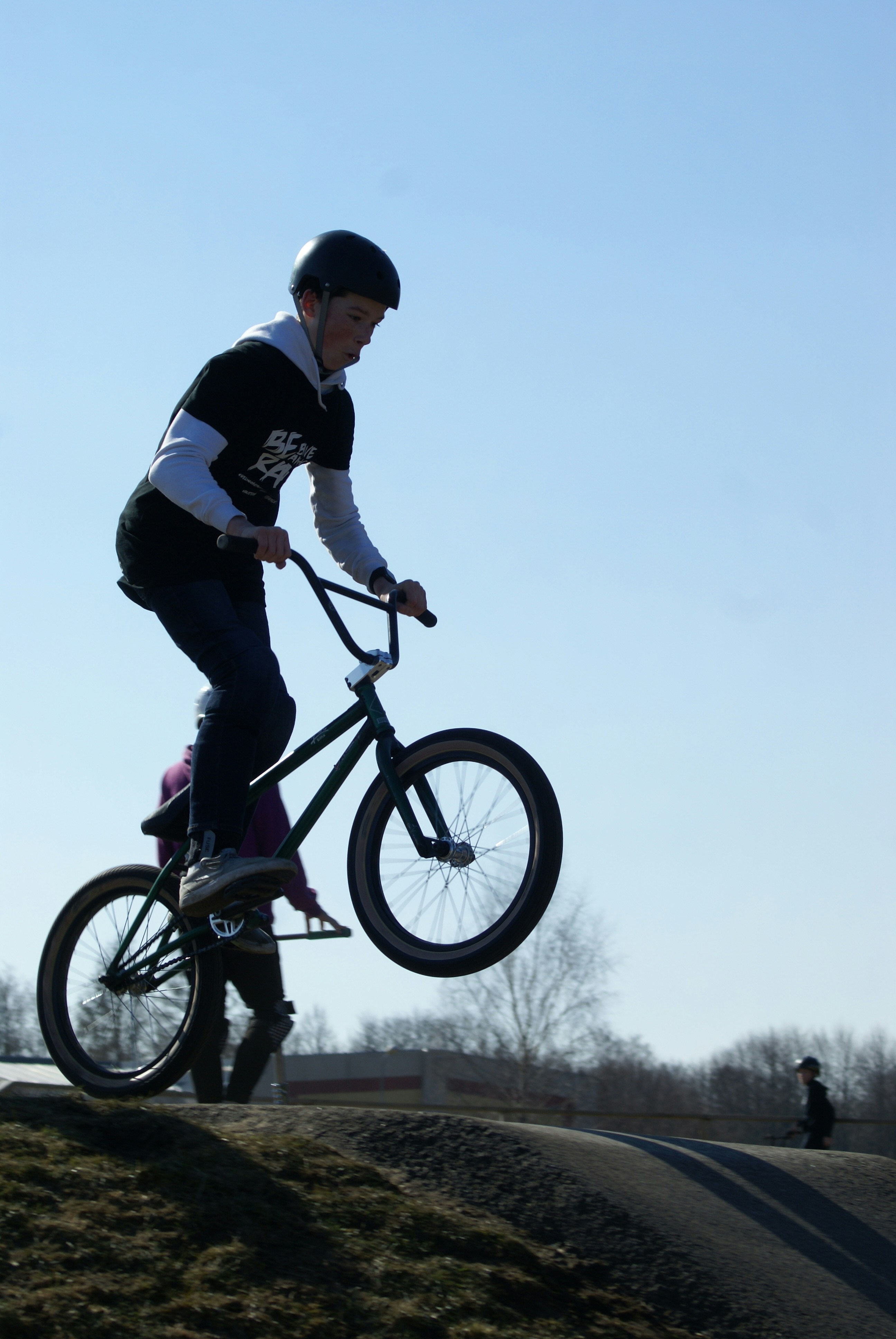 Midair BMX: A Rider Defies Gravity on a Sunny Track