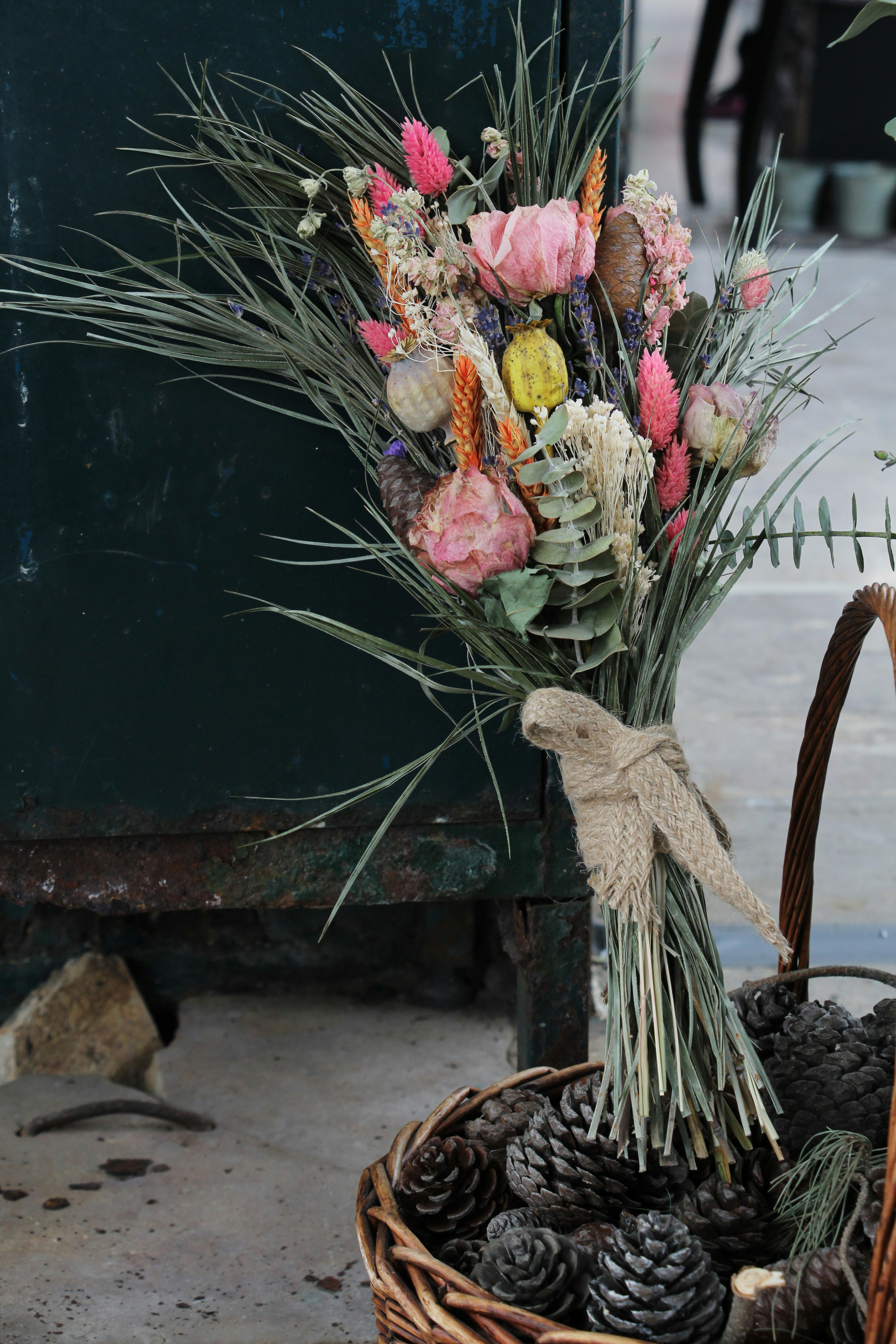 Jute-Tied Dried Bouquet by a Pinecone Basket
