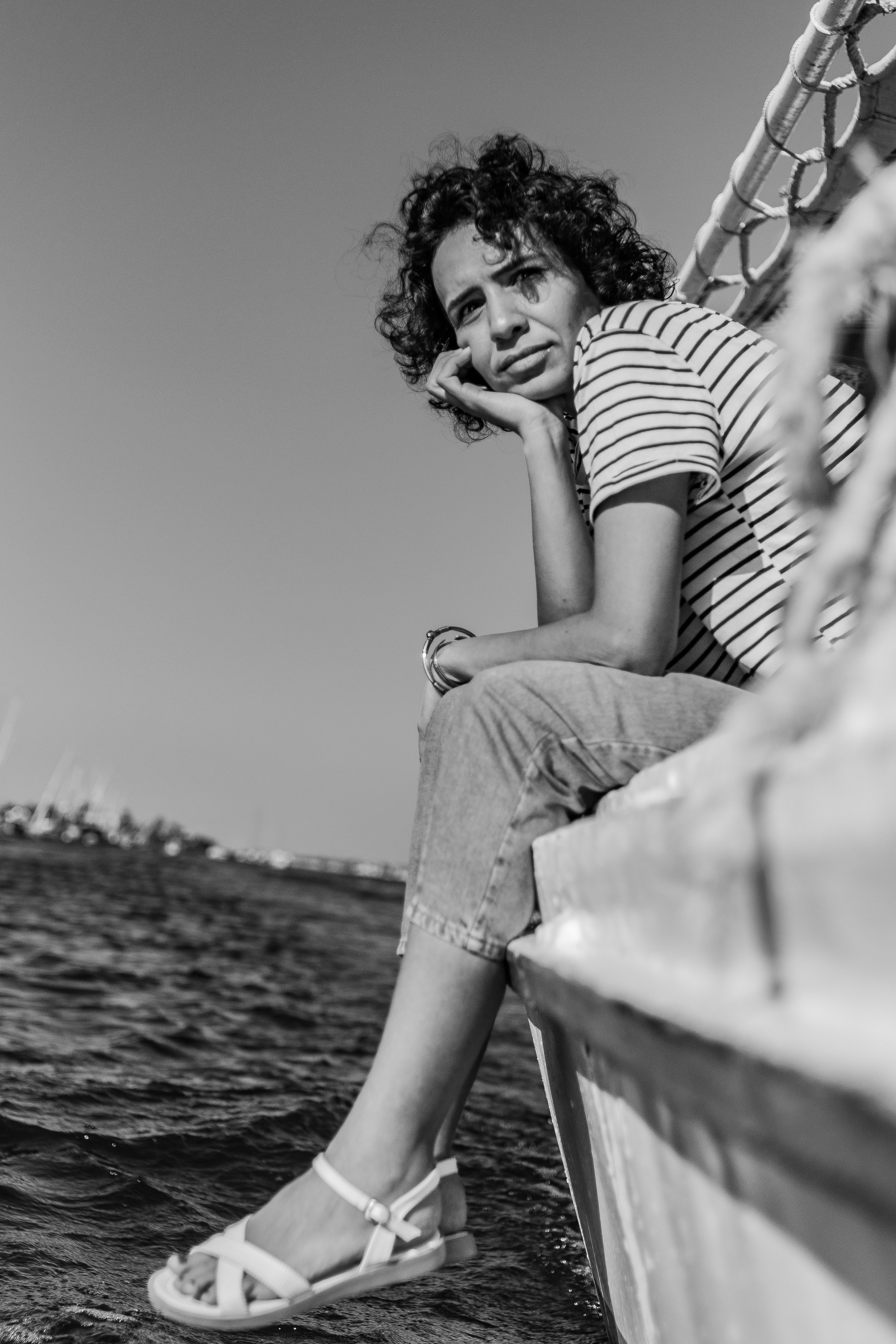 Gaze Along the Railing: Quiet Contemplation by the Water