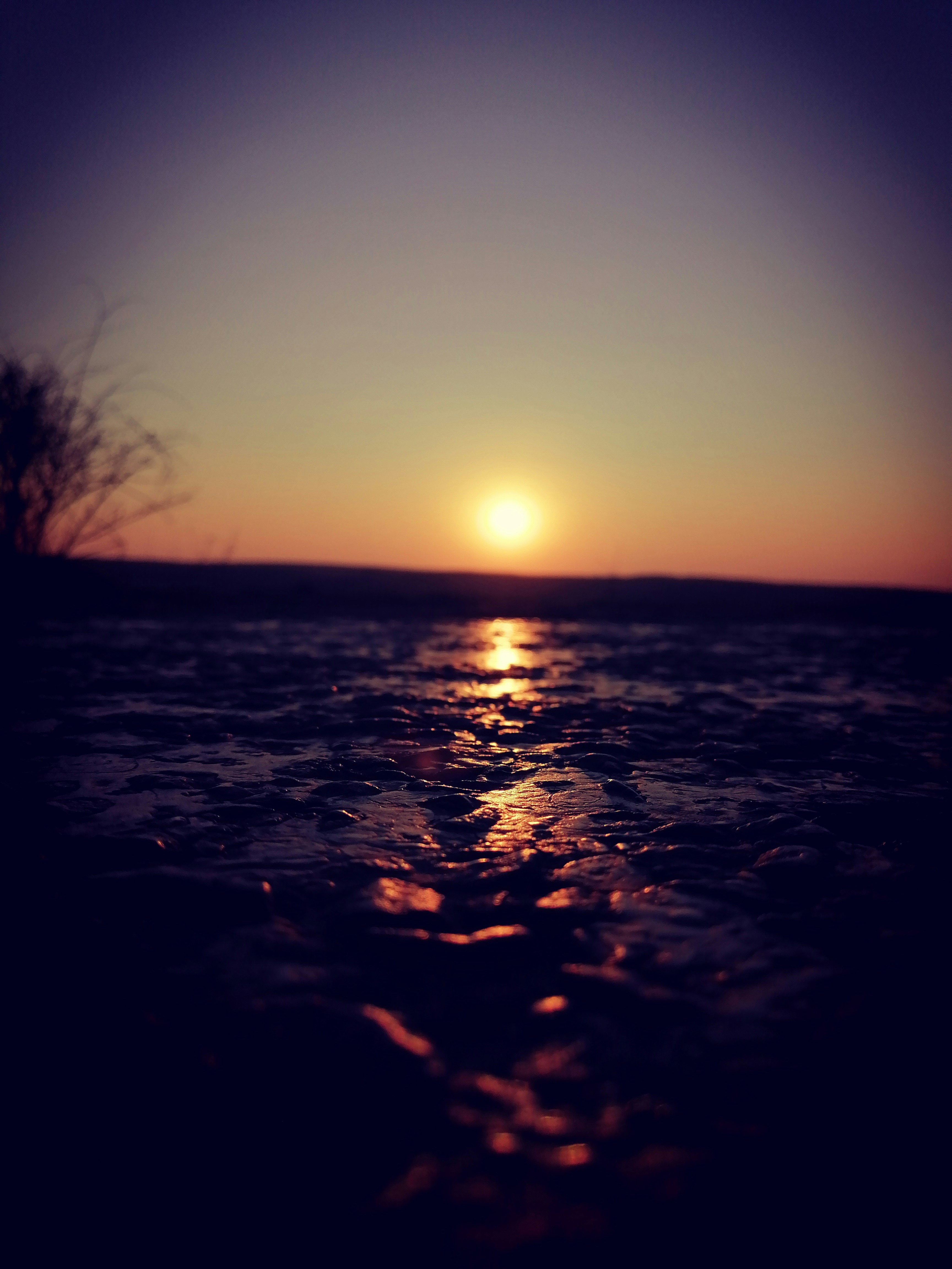 The sun is setting over the water in the ocean photo – Free Sea Image ...