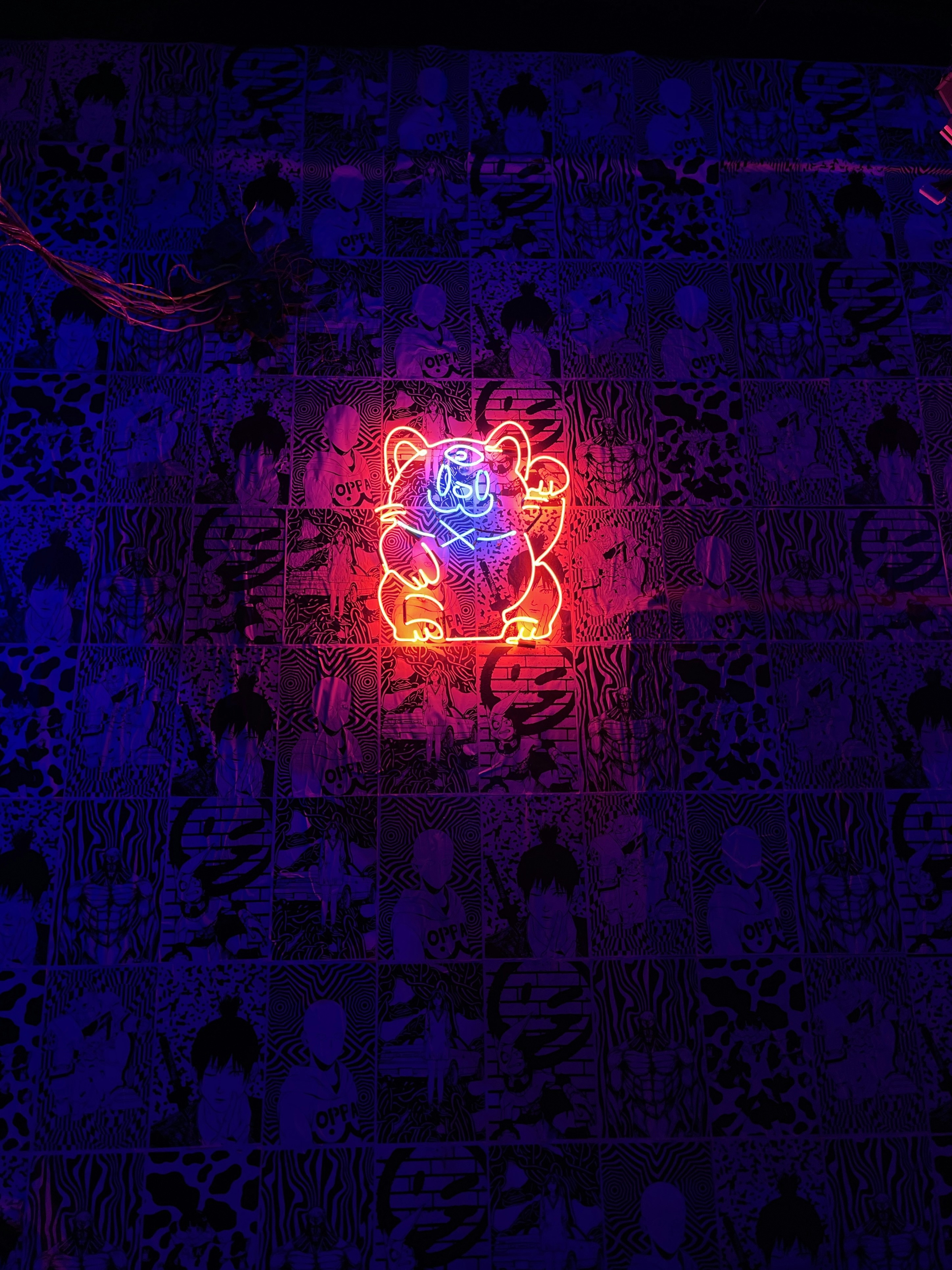A neon teddy bear sitting on top of a tiled floor photo – Free ...