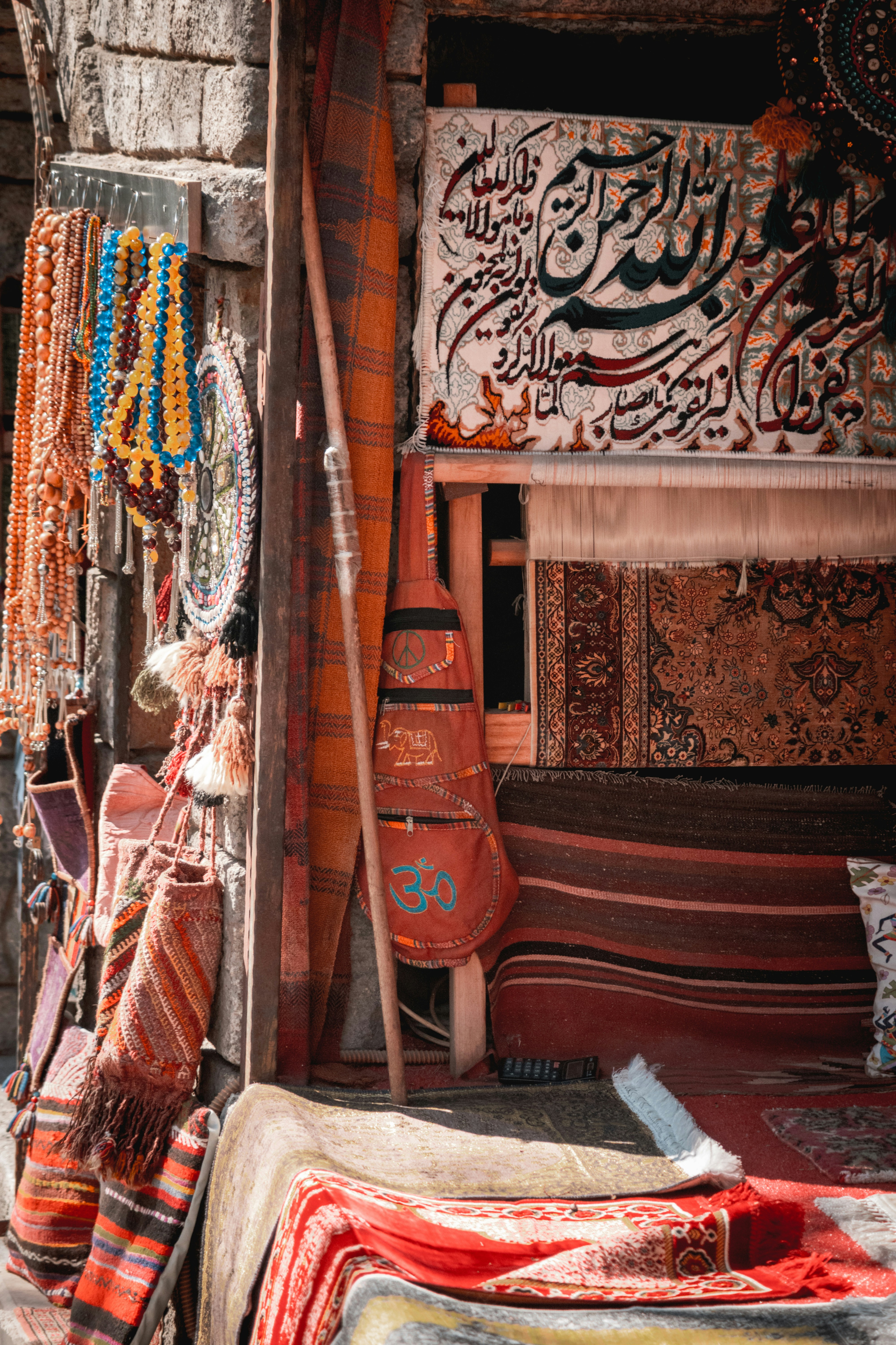 A store with lots of rugs and rugs hanging from the ceiling photo ...