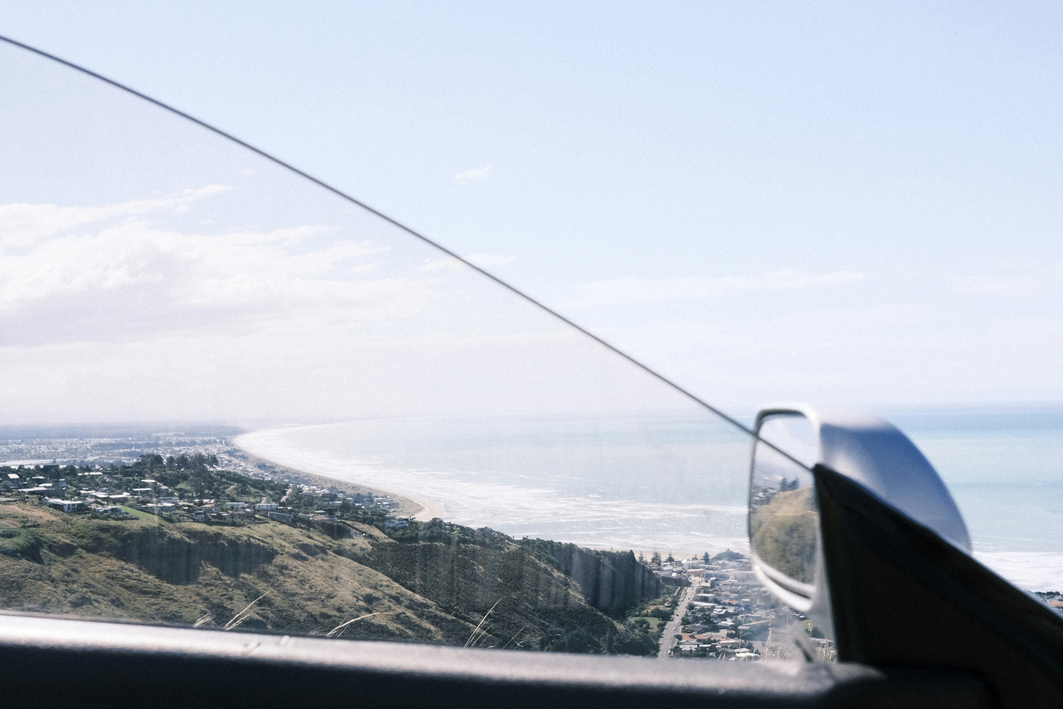 Coastal Drive: Mirror and Curve Against the Cliff Line