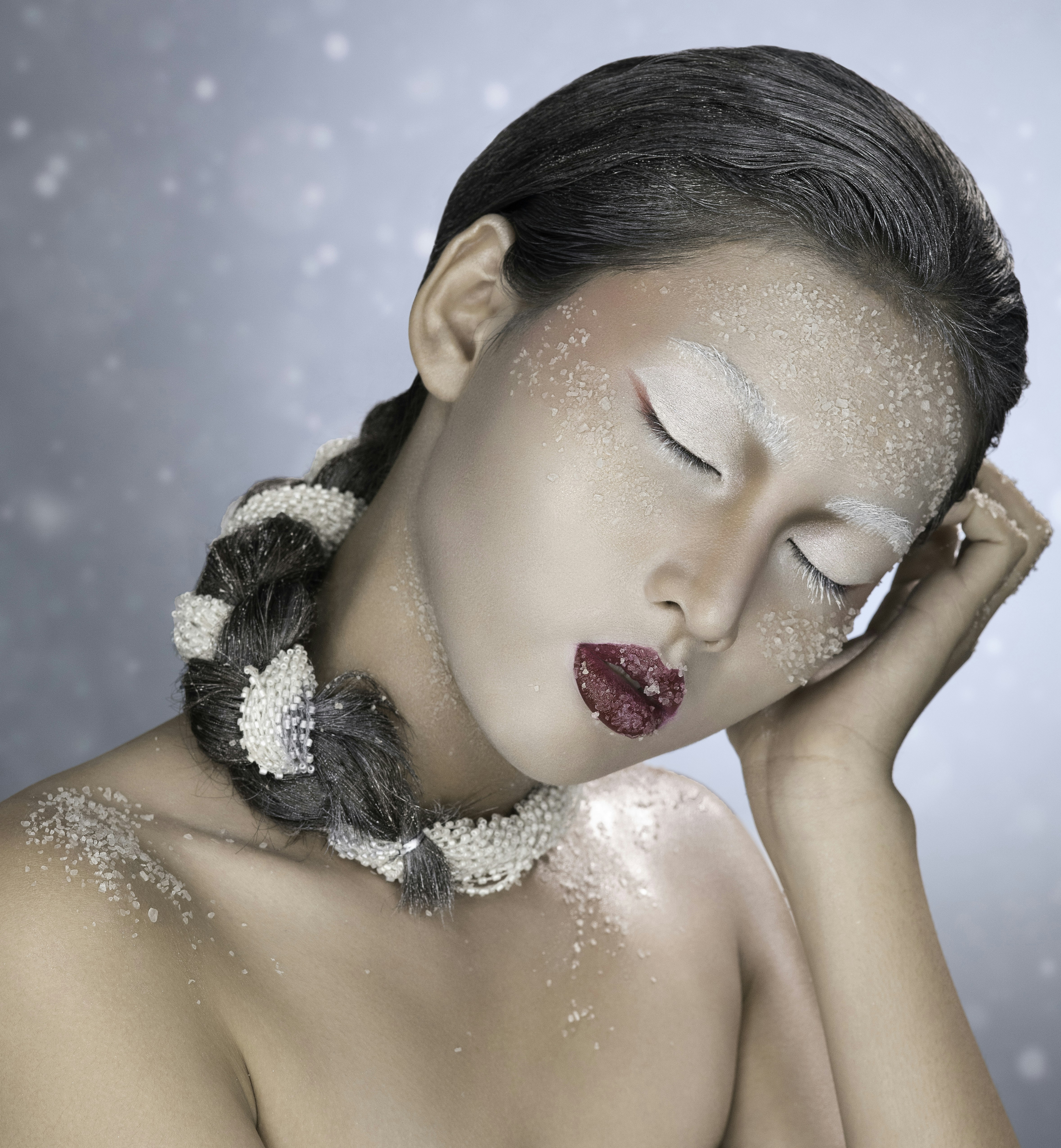 A woman with snow on her face and a braid around her neck photo – Free ...
