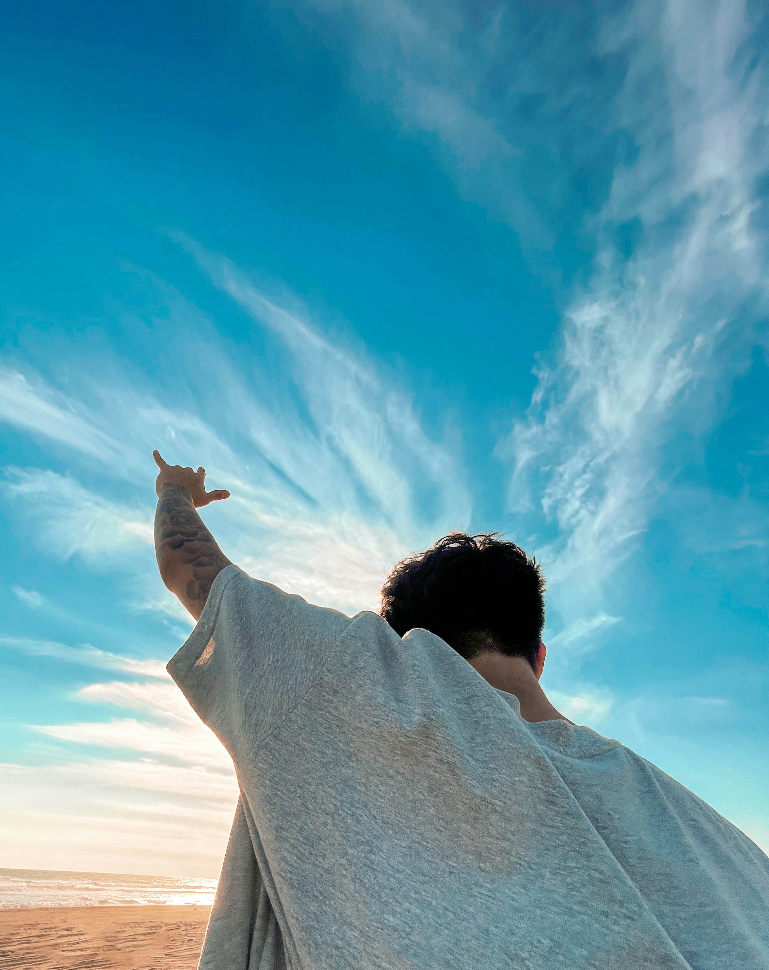 a man is flying a kite on the beach