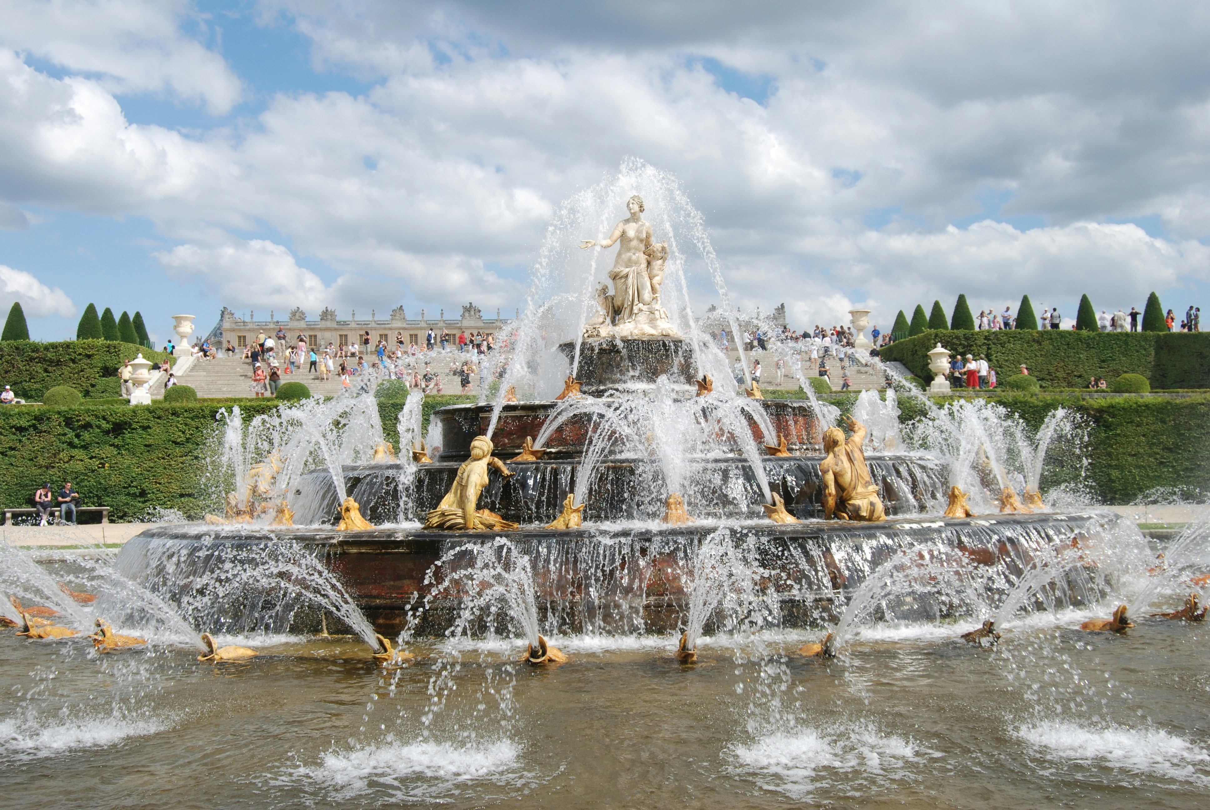 A water fountain with statues on top of it photo – Free Grey Image on ...
