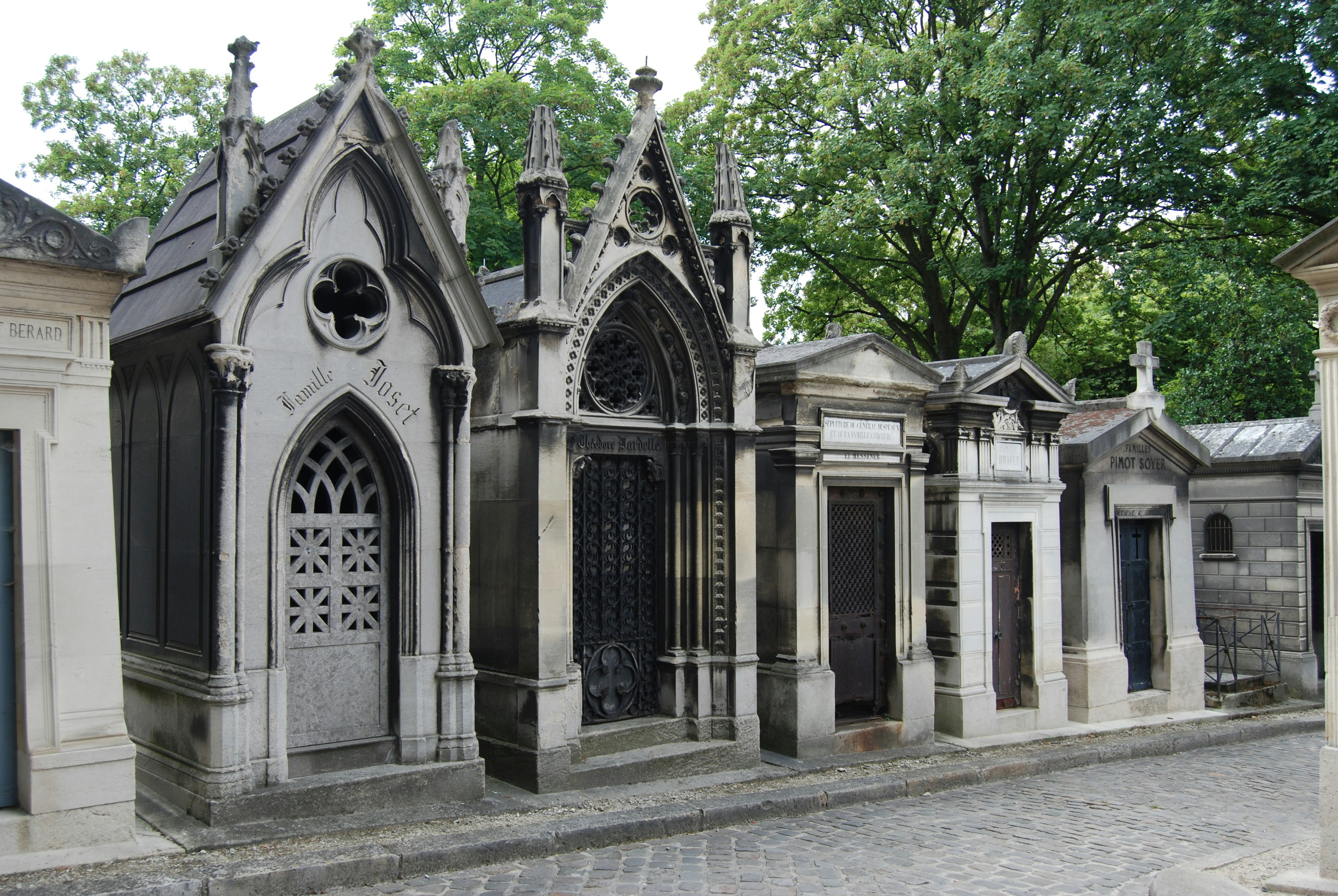 Gothic Cadence on Cobblestones: A Quiet Row of Mausoleums