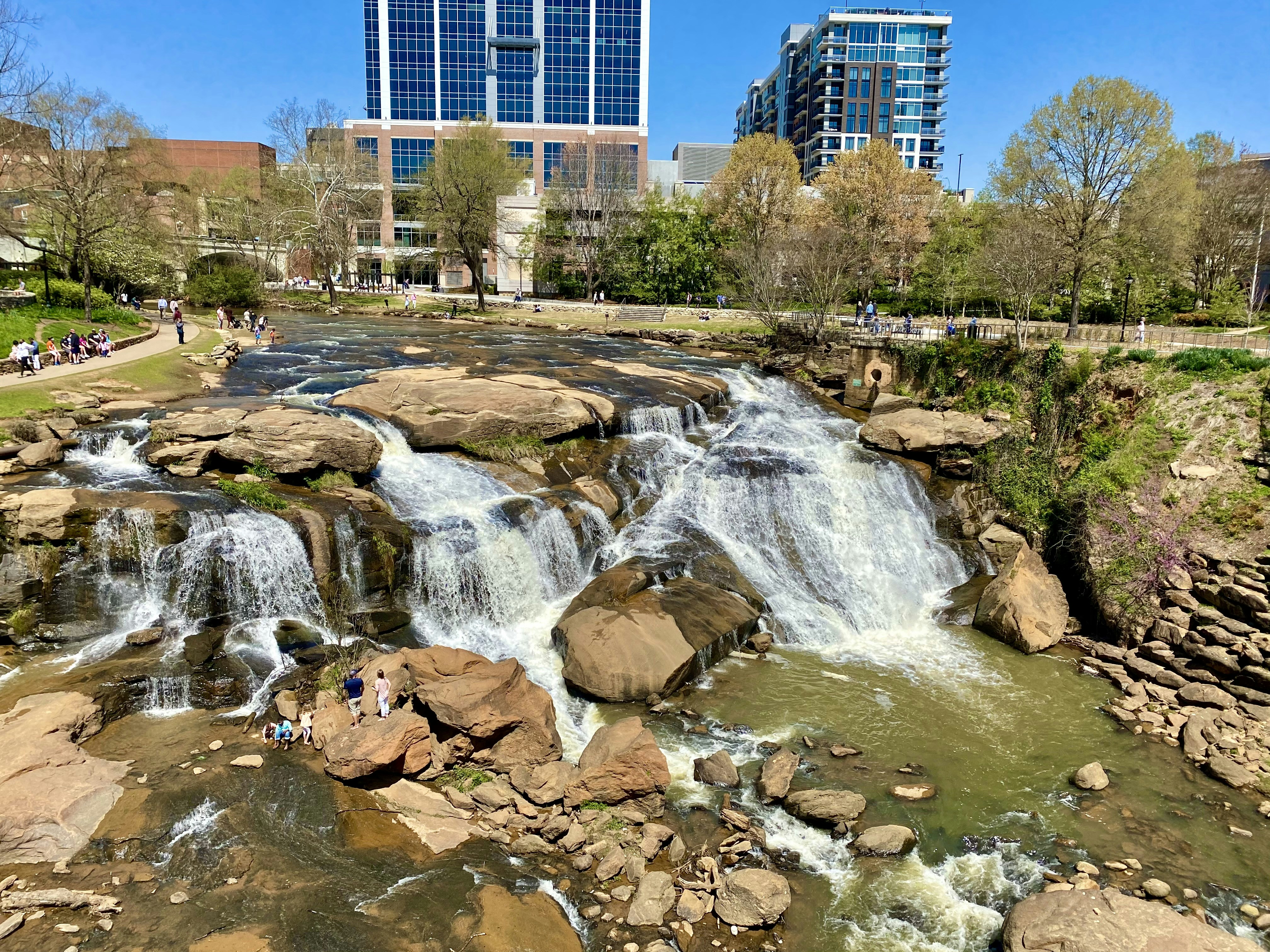 A waterfall in the middle of a city park photo – Free Waterfall in the ...
