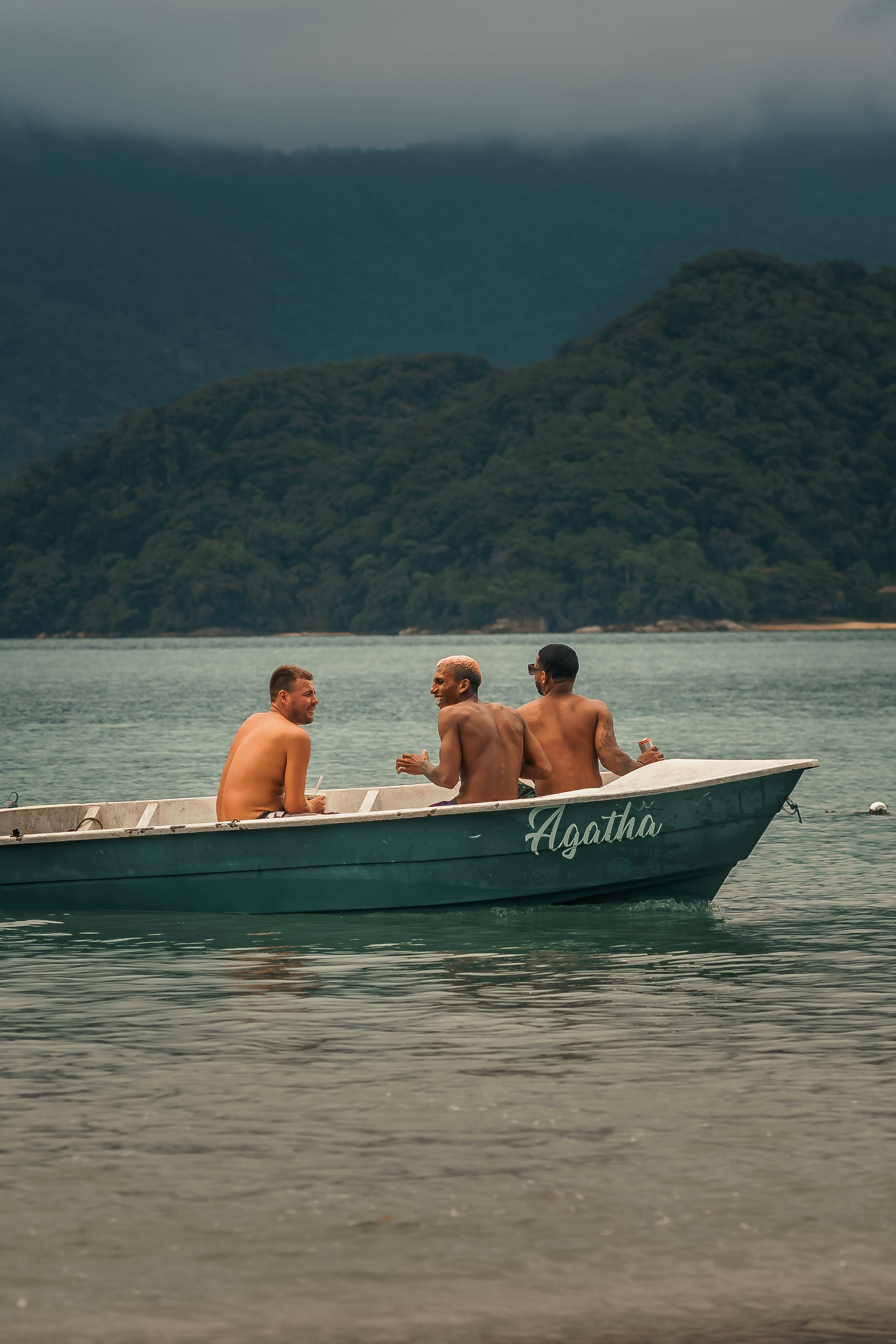 Agatha on the Quiet Lake: Three Friends in a Teal Boat