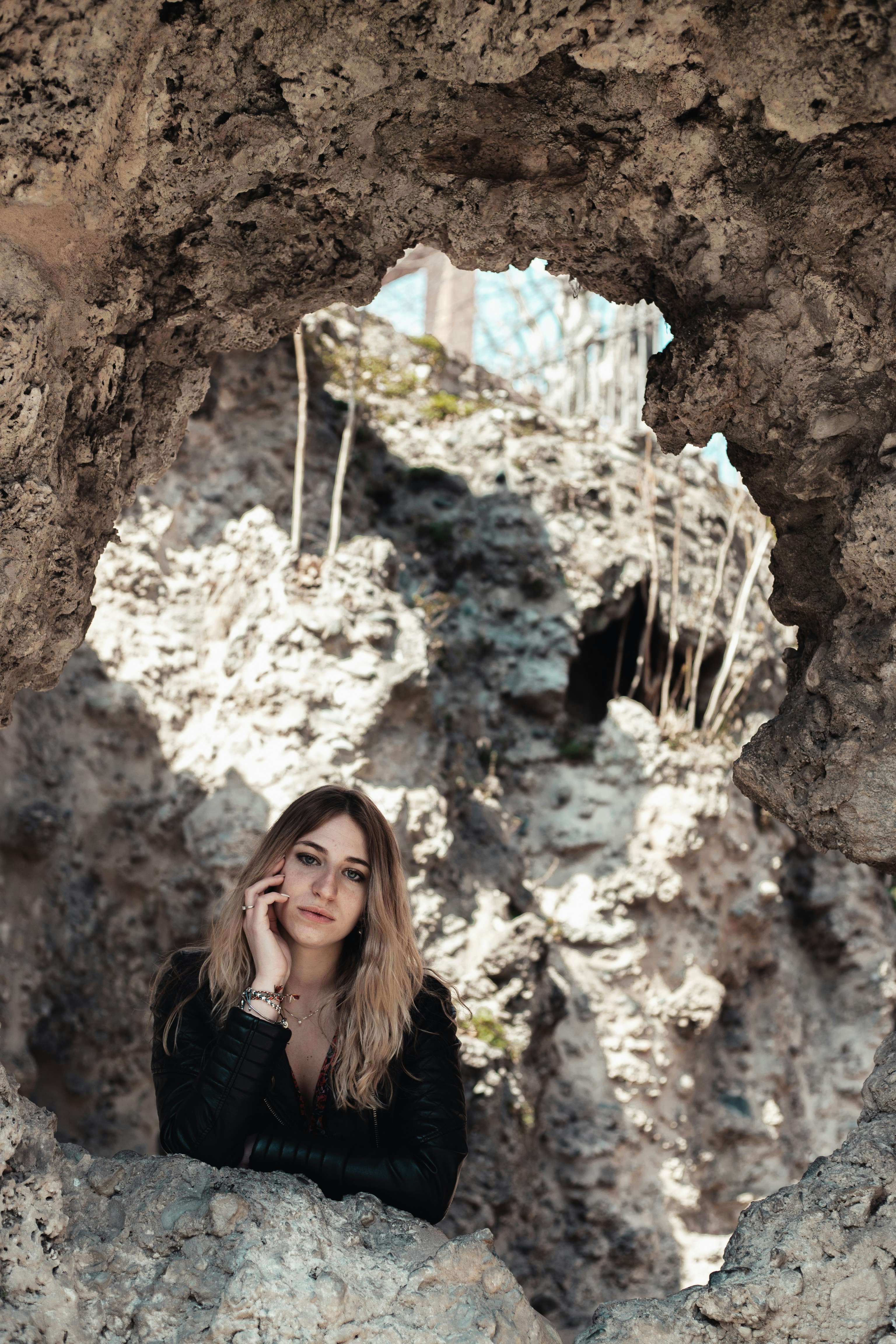 Through the Stone Oval: Portrait Amid a Cavernous Frame
