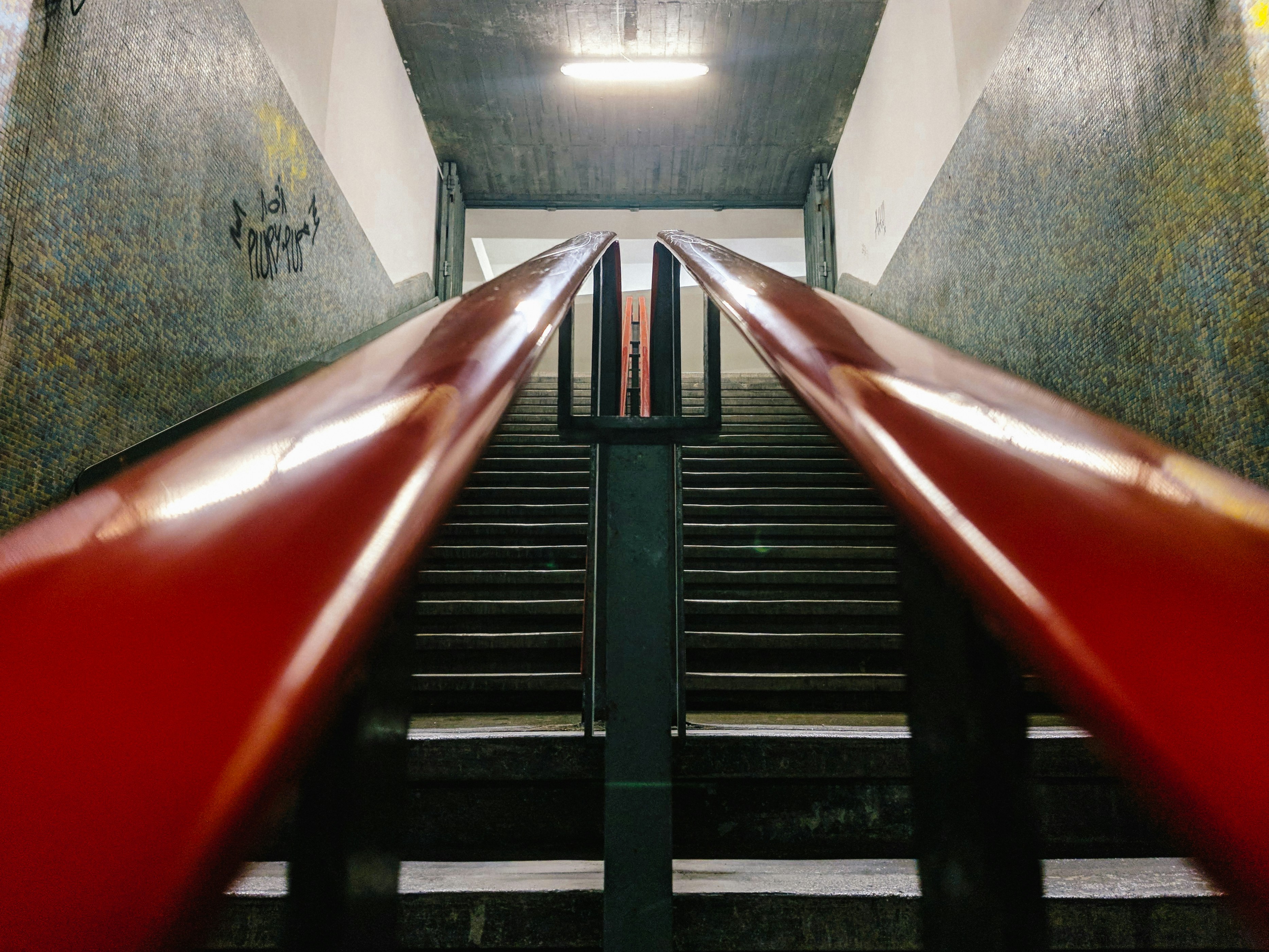 A long red rail going up a set of stairs photo – Free Lisbon Image on ...