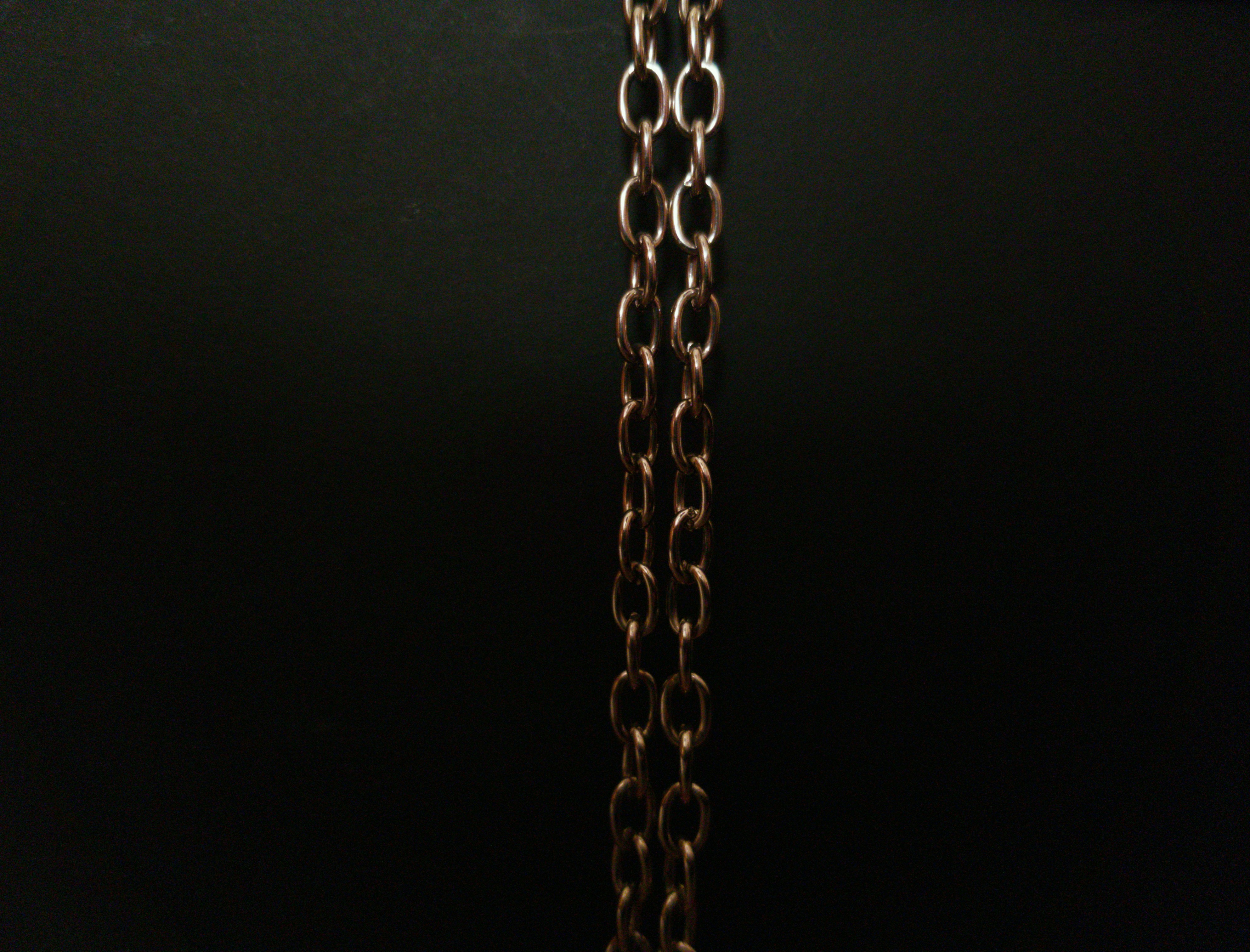 A large metal chain hanging from a ceiling photo – Free Grey Image on ...