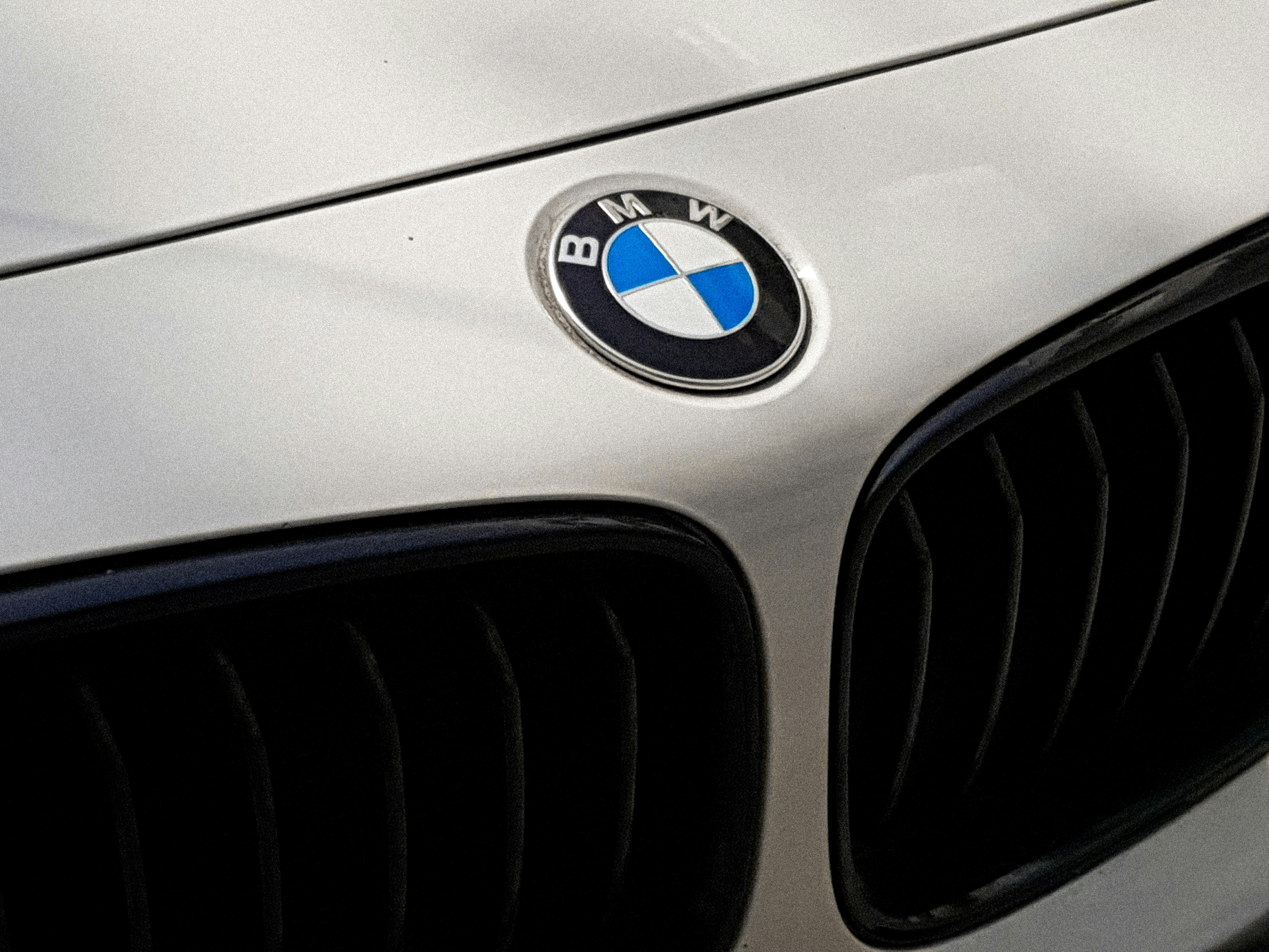 A close up of a bmw logo on the front of a car photo – Free Logo Image ...