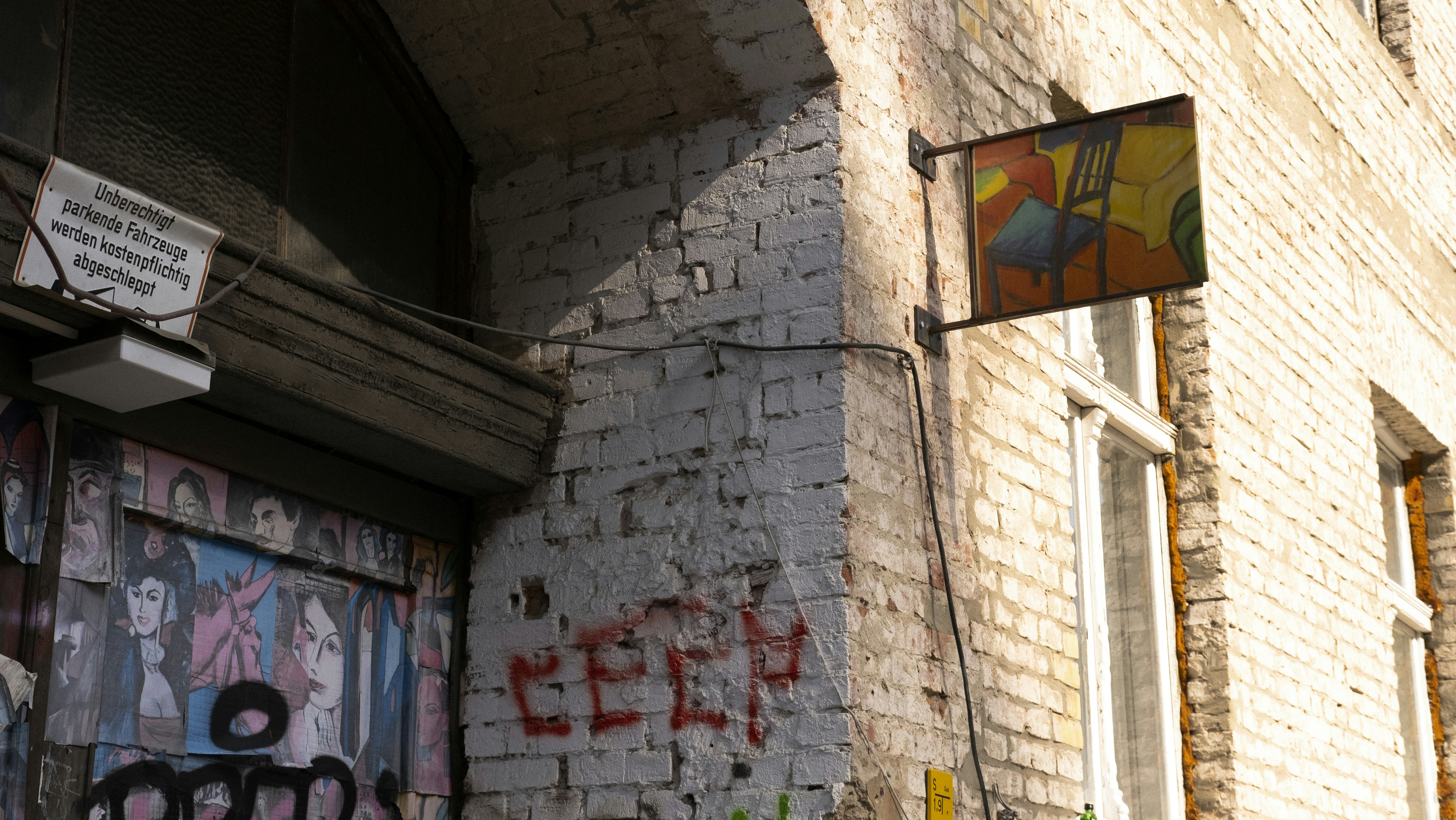 a brick building with graffiti on the side of it