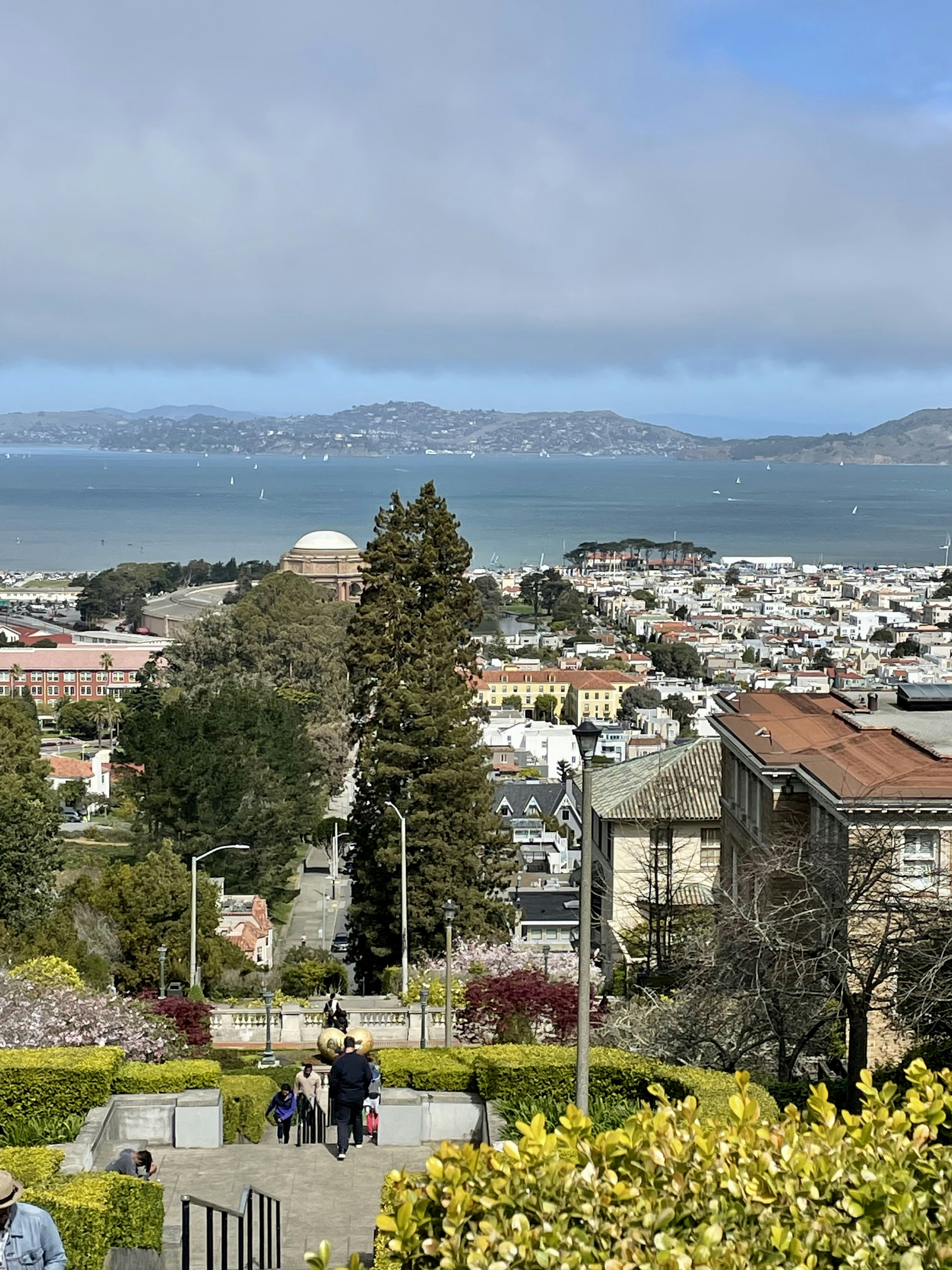 Promenade with a Domed Beacon: A hillside cityscape over the bay