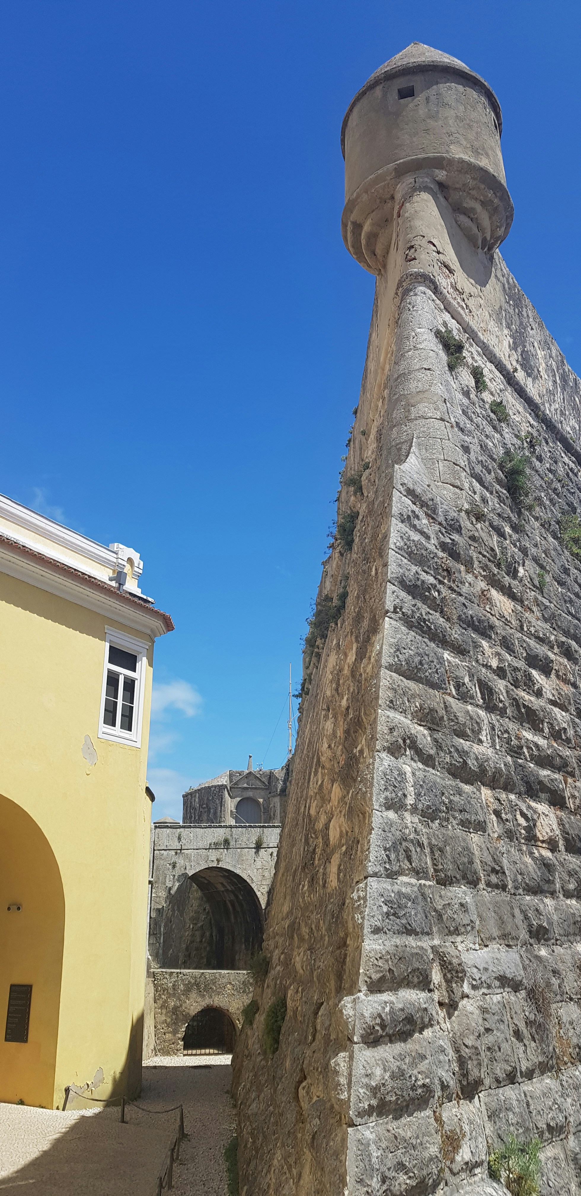 Turreted Sentinel Over a Bright Mediterranean Arch