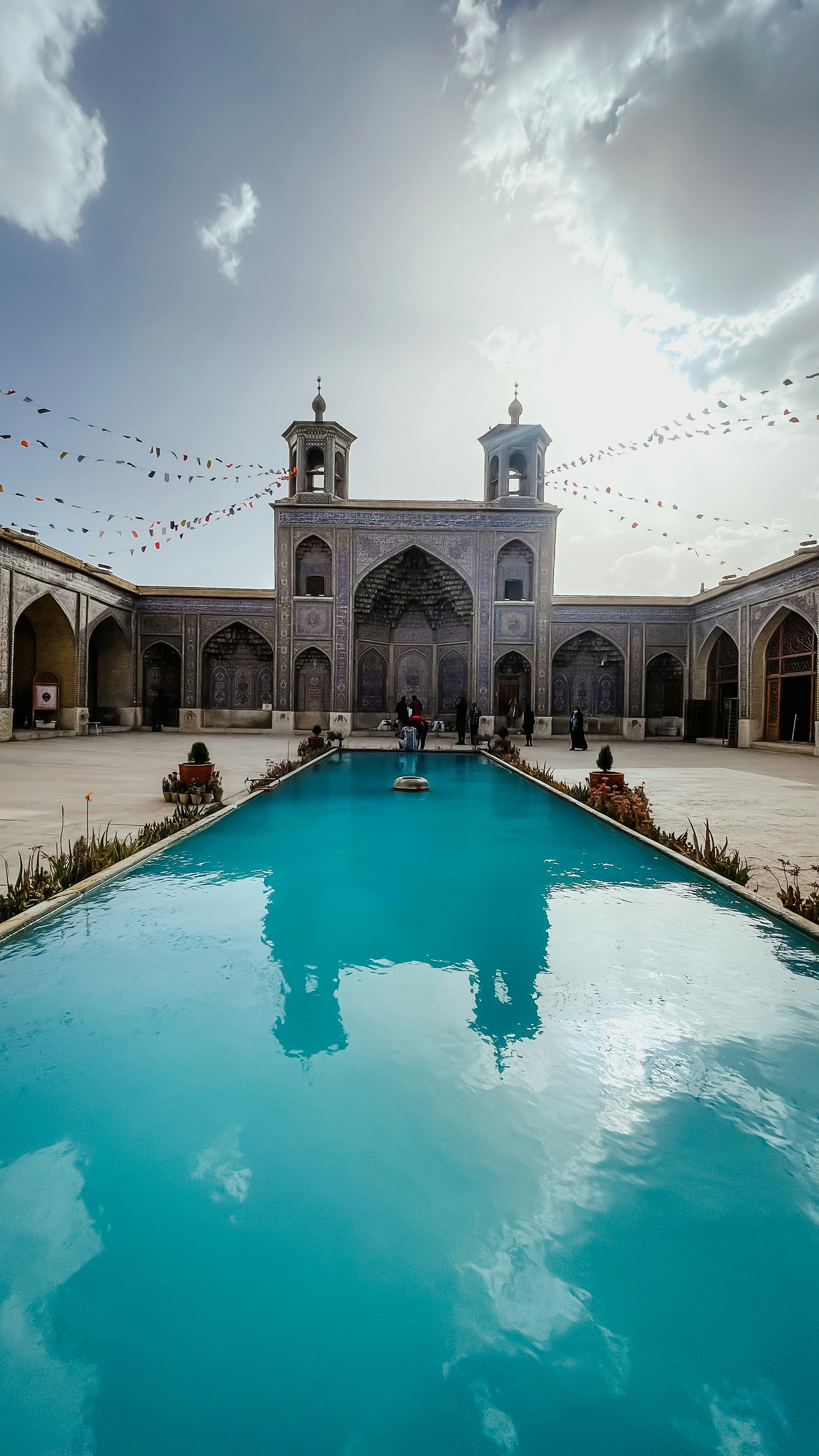 Azure Mirror: Symmetry of a Twin-Minaret Courtyard