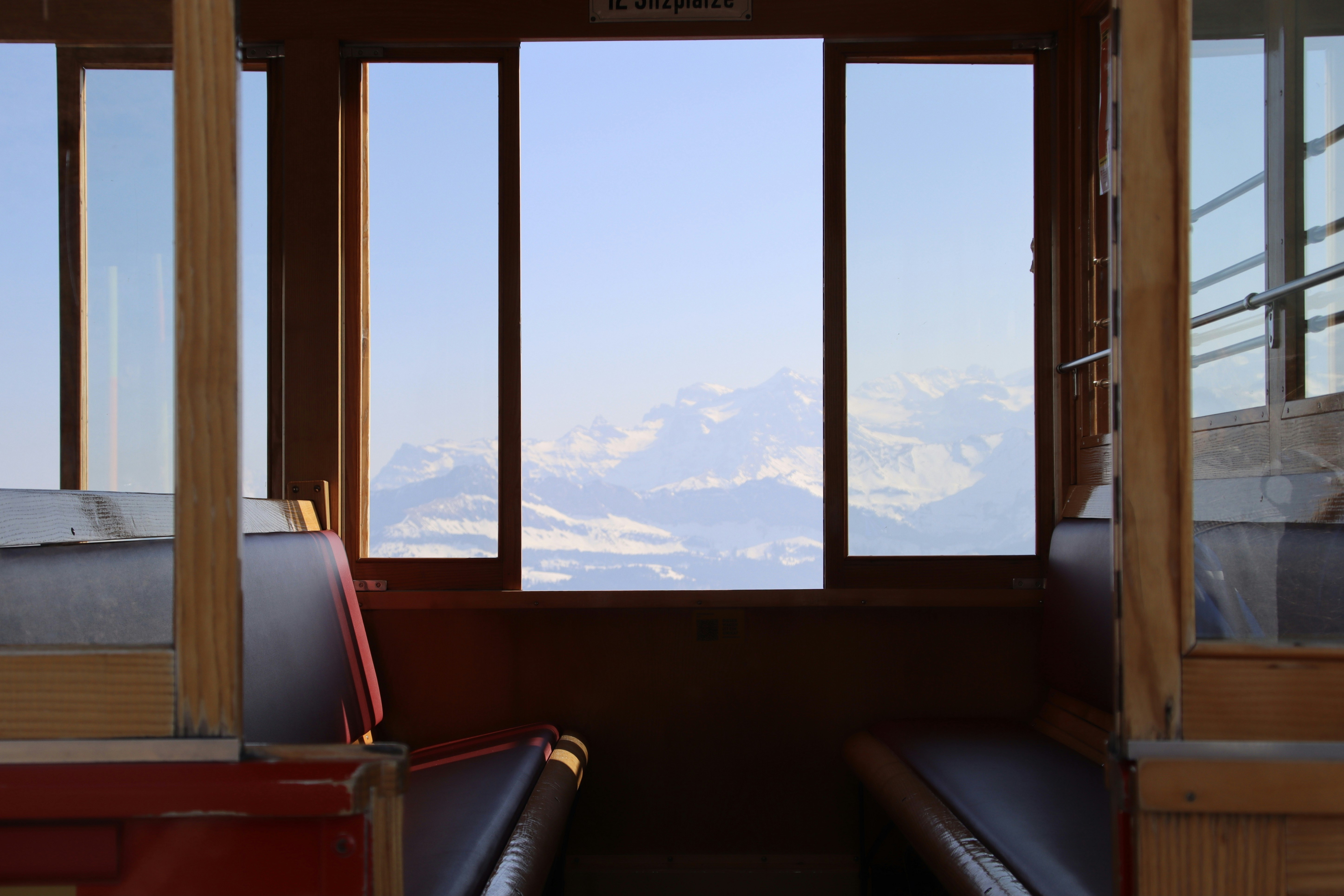 Alpine Panorama Framed by a Rustic Cable-Car Window