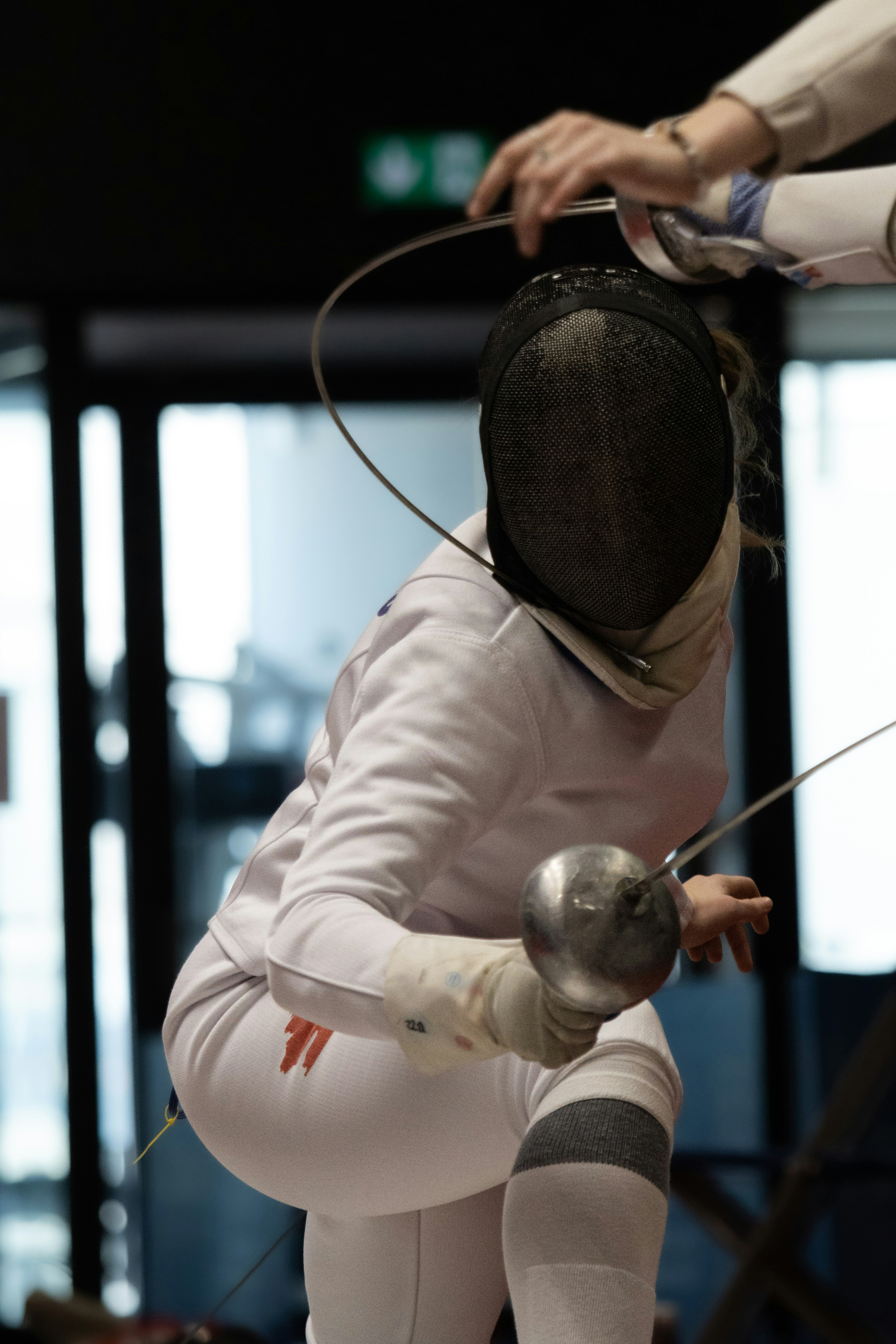 A woman in white fencing outfit holding a metal ball photo – Free ...