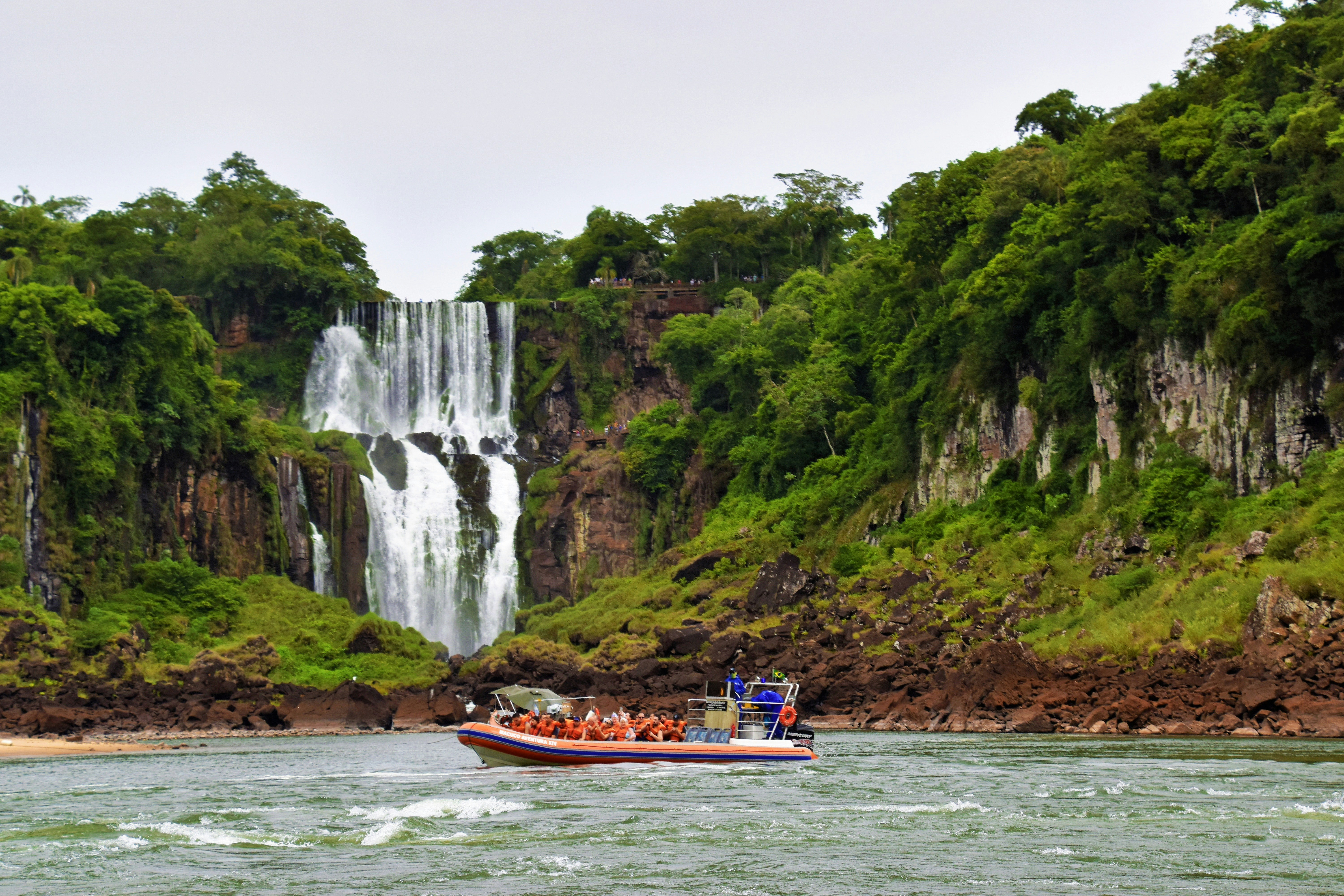 A boat in the water near a waterfall photo – Free Iguazu falls Image on ...