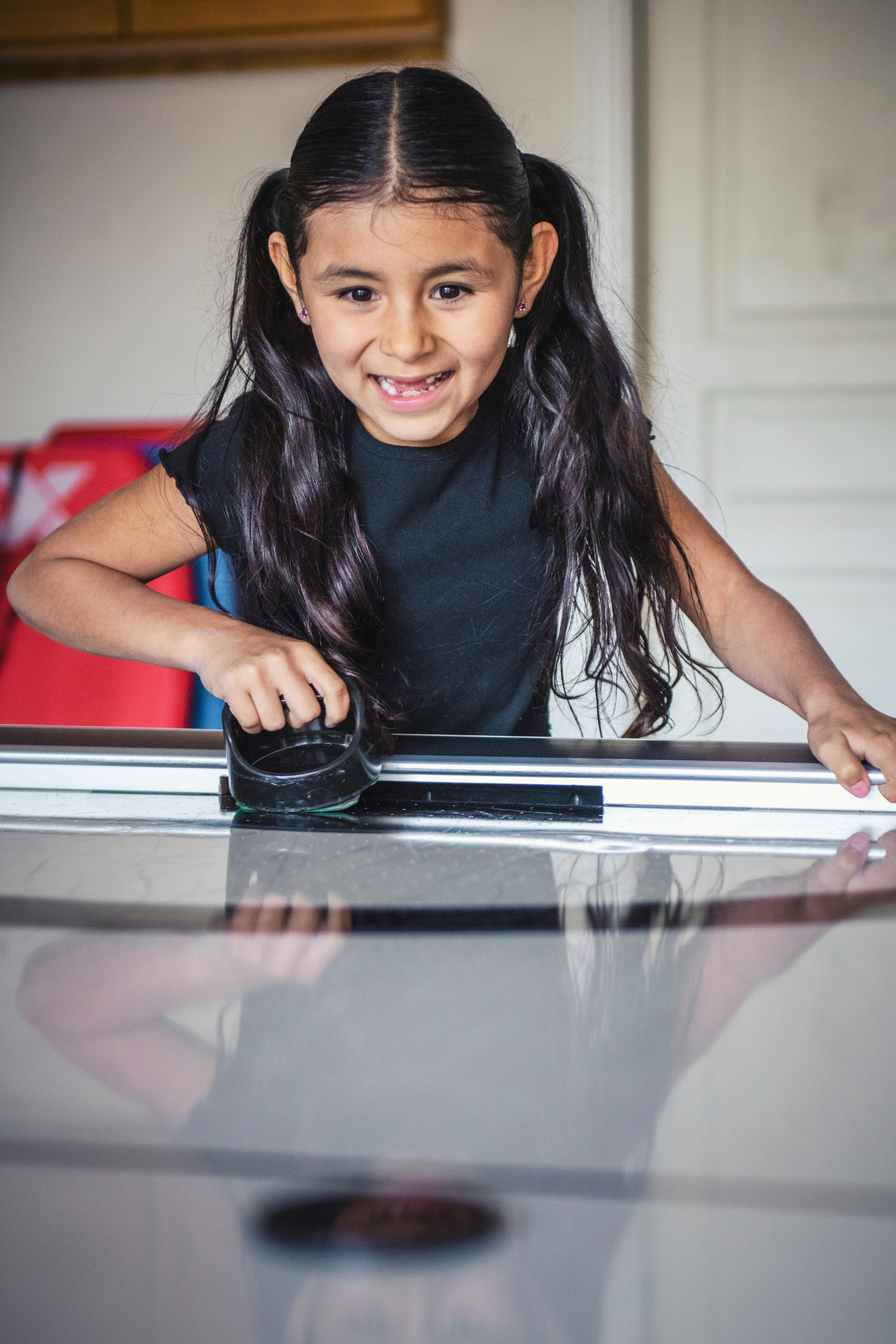 Window-Wash Wonder: A Tiny Smile Framed by Glass