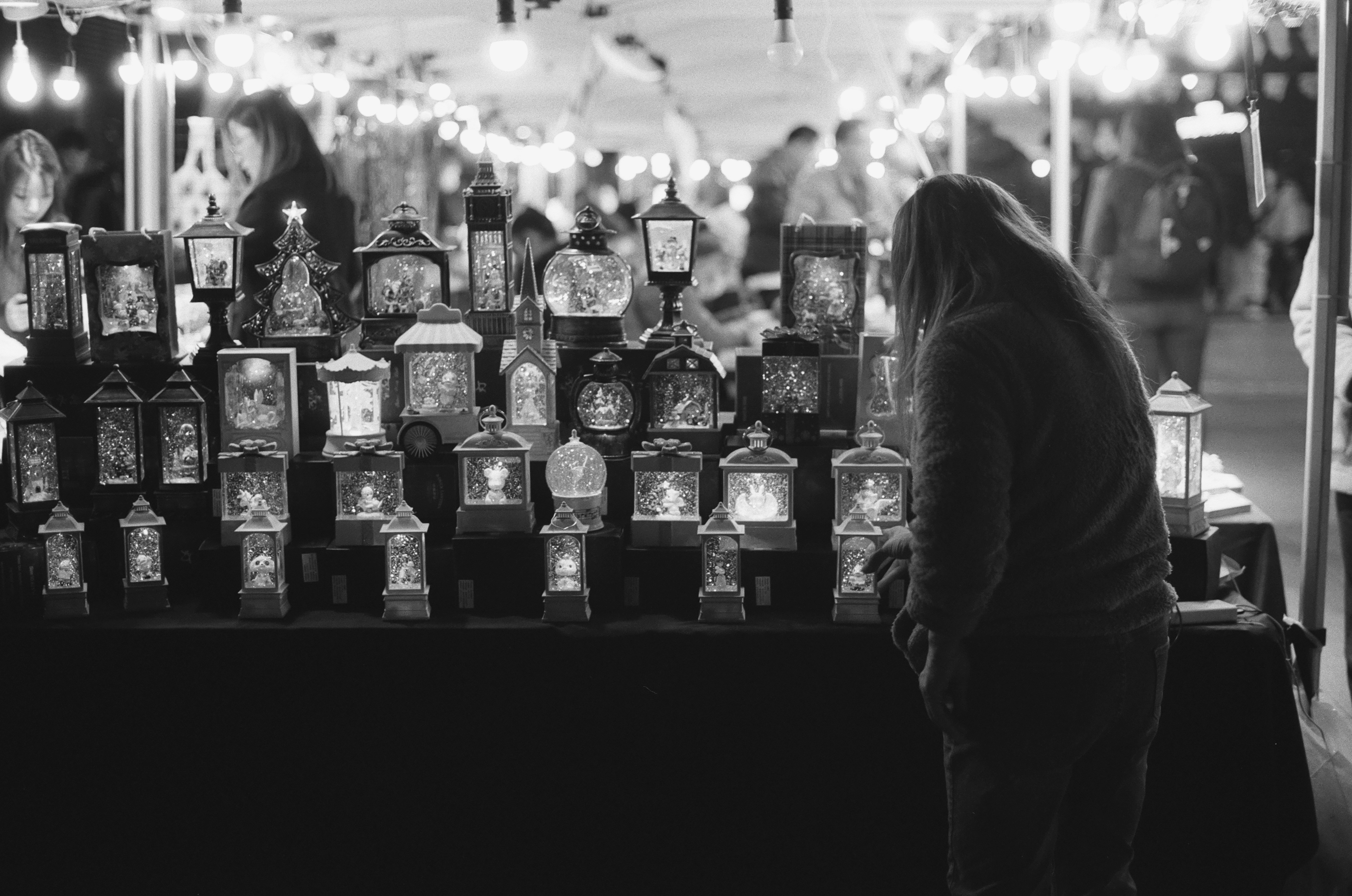 Monochrome Lantern Market: A Quiet Moment of Curiosity