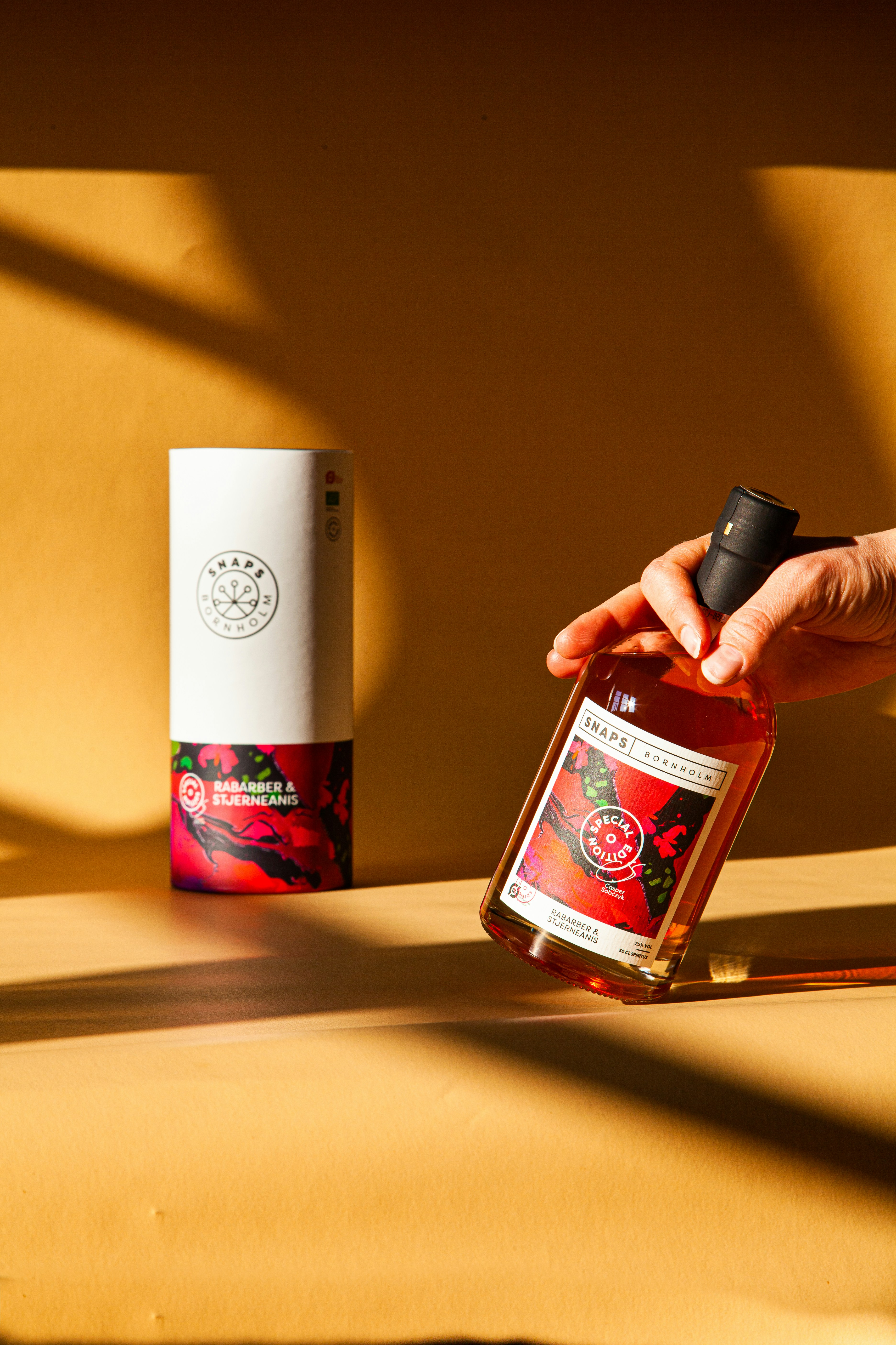 A hand holding a pen and a bottle of sauce photo – Free Bottle Image on ...