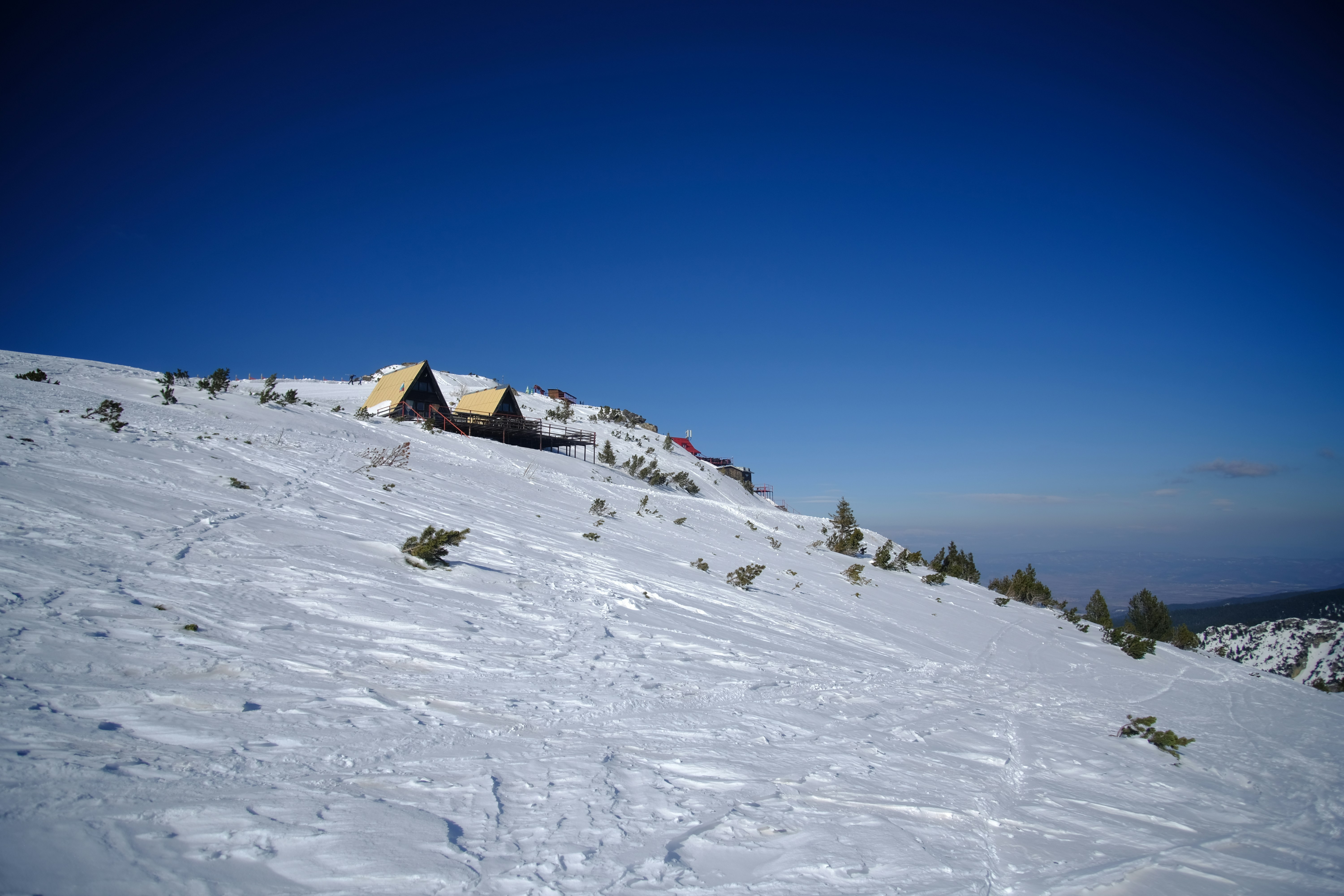 A house on a snowy hill photo – Free Blue Image on Unsplash