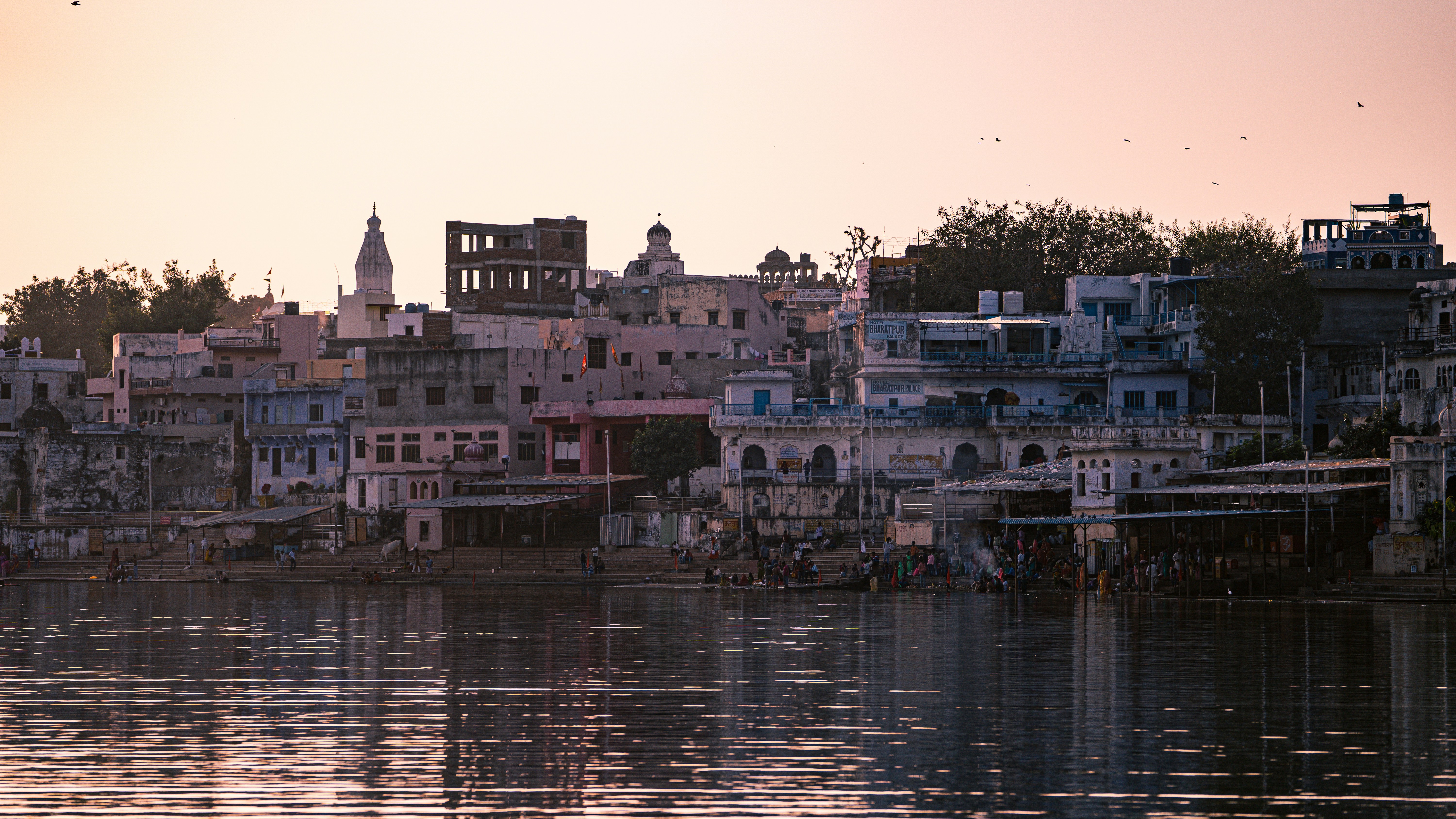 Sunset Over Riverside Decay: Quiet Towers and Reflections