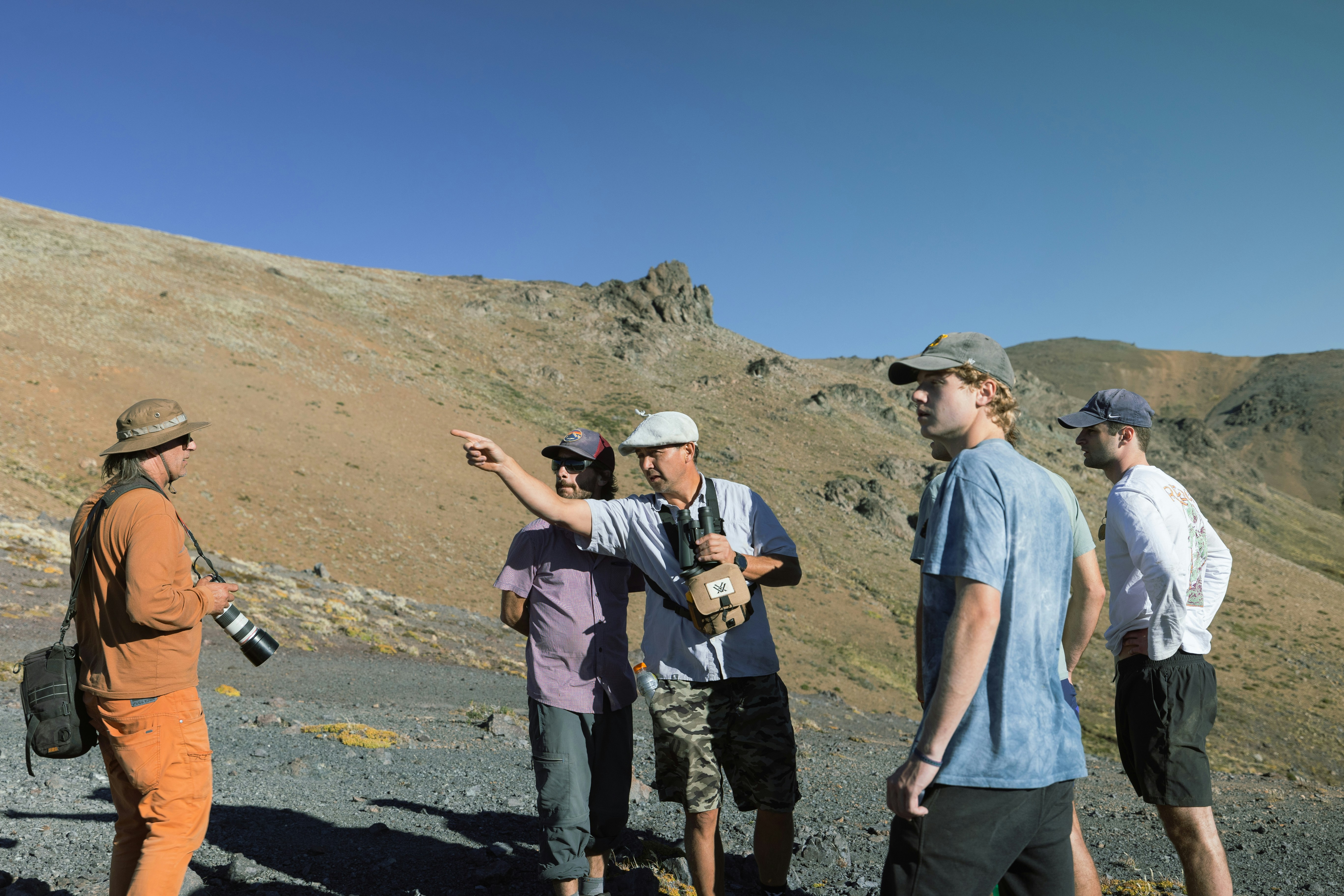 Outcrop Briefing: A Trekking Crew Examines the Terrain