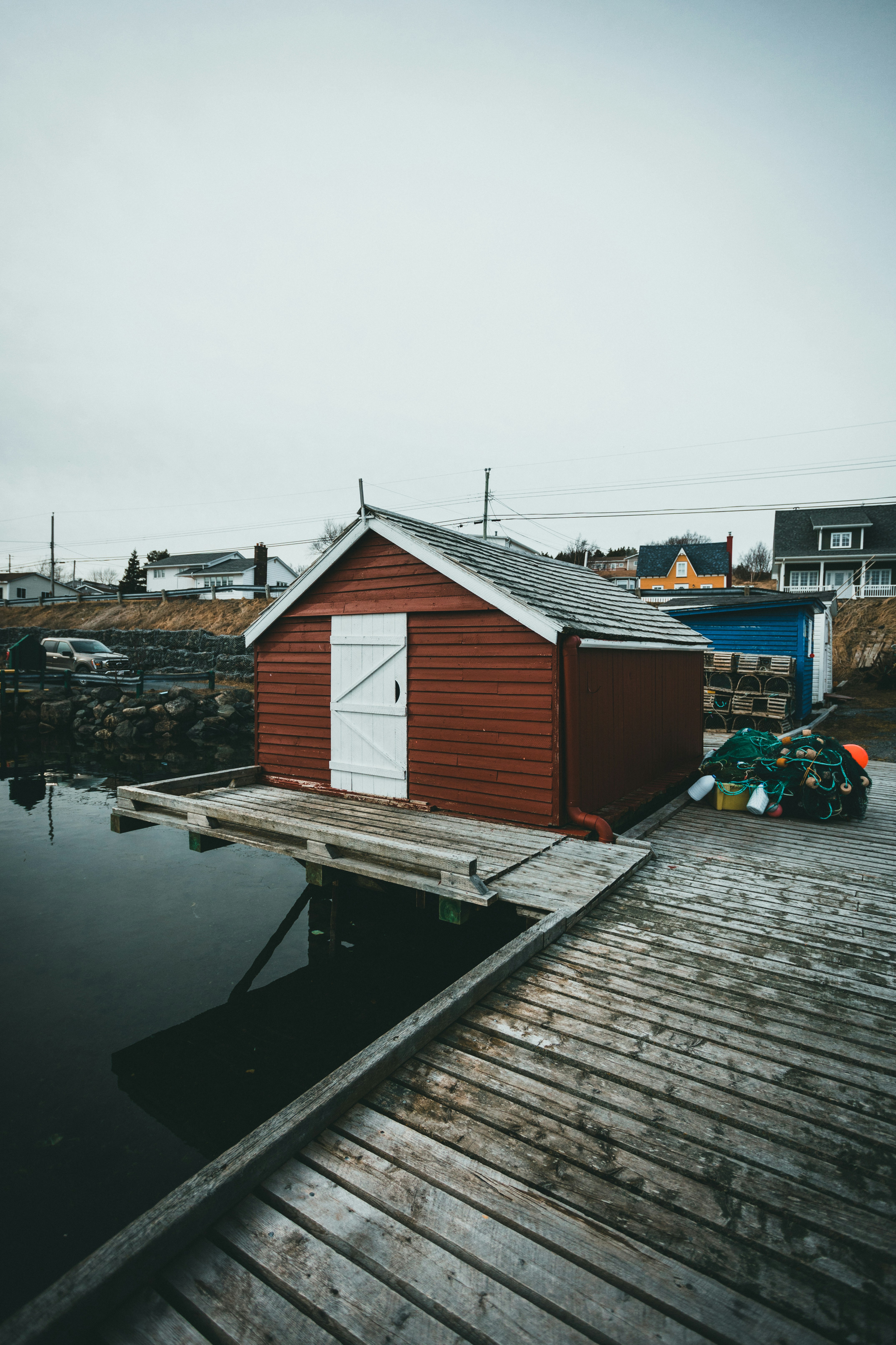A small red building on a dock photo – Free Building Image on Unsplash