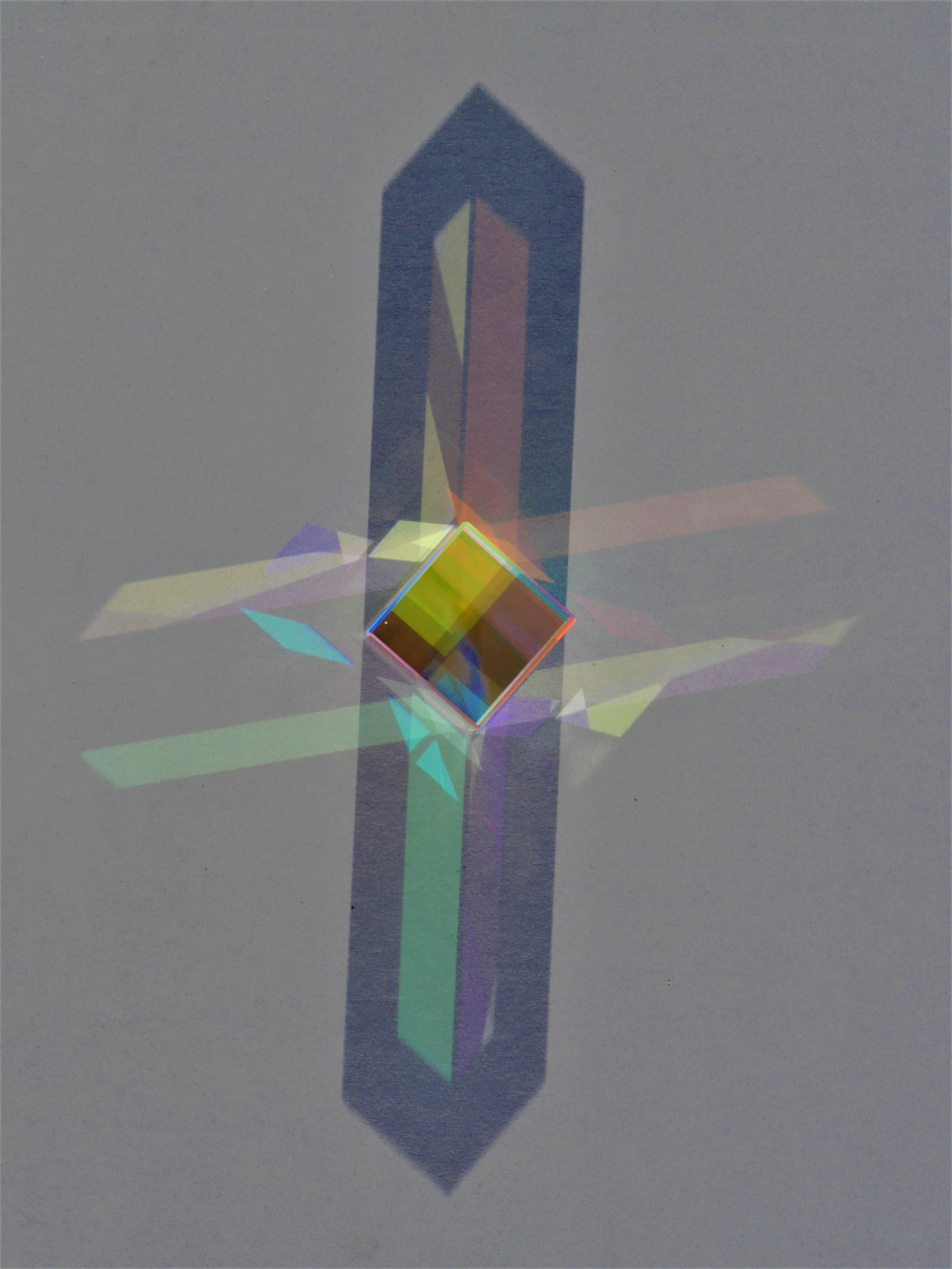 Colorful reflections and shadows cast by a geometric prism on a neutral surface.