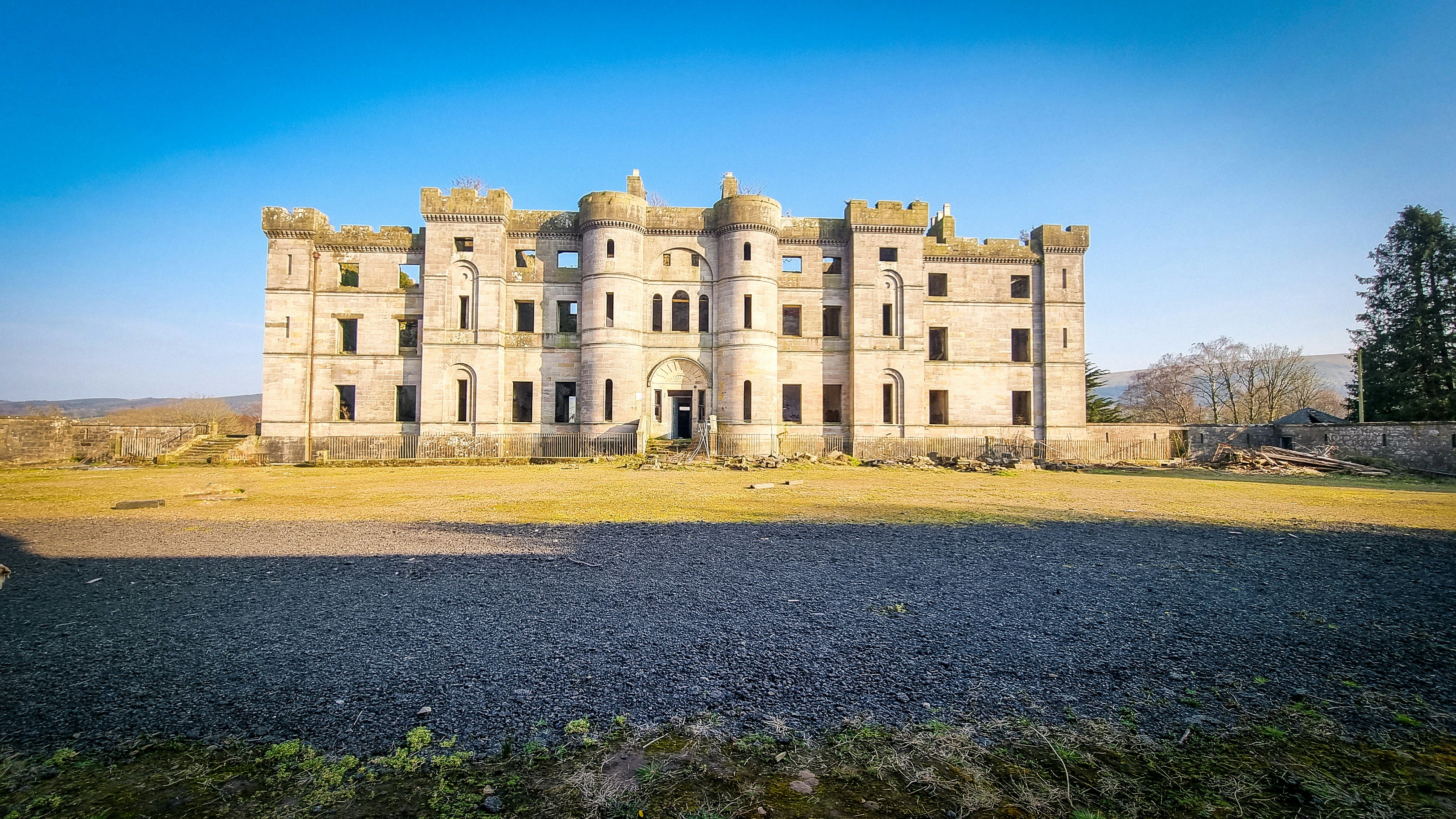 A large stone building photo – Free Dalquharran castle Image on Unsplash