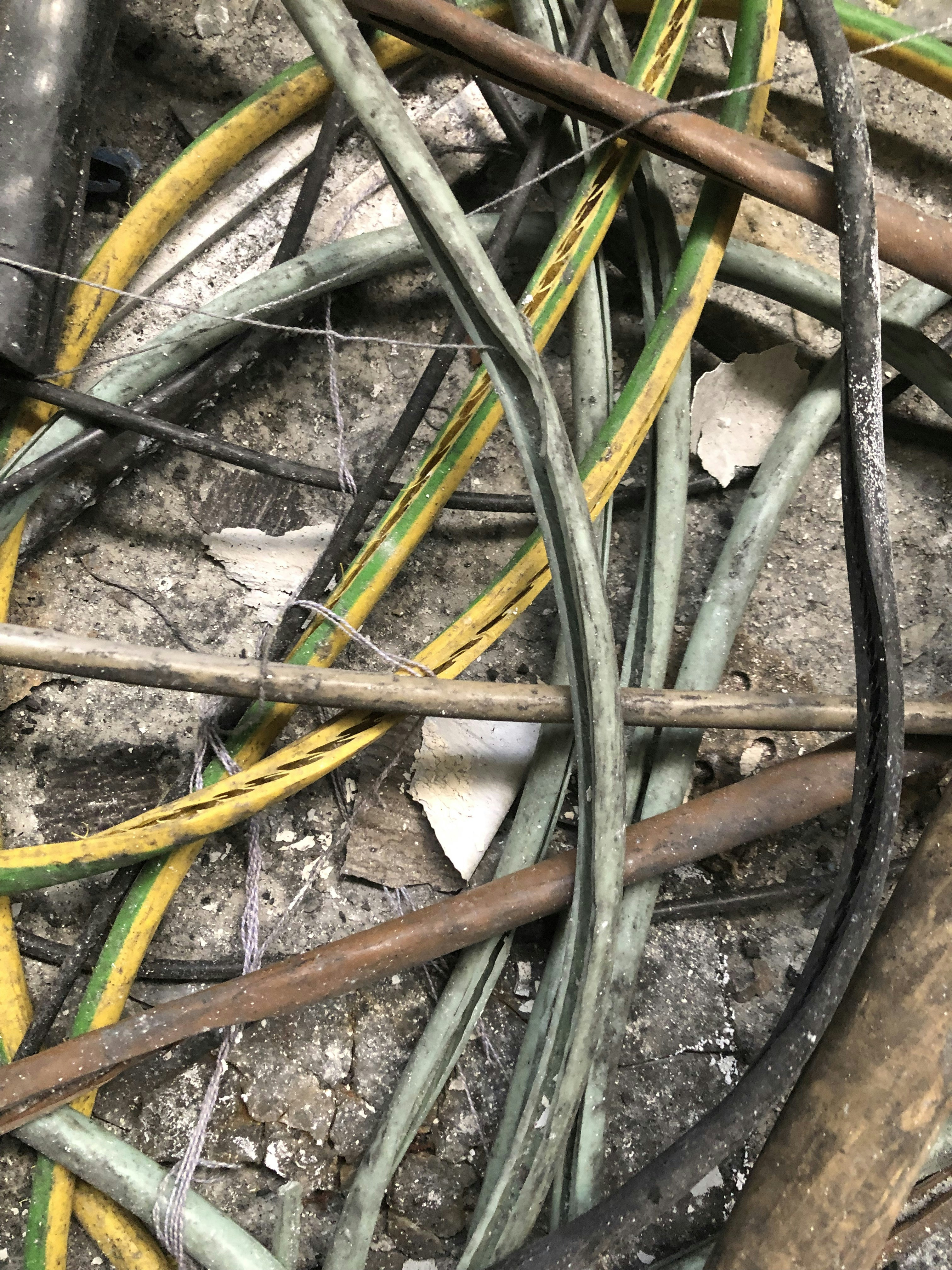 Tangled Cables on a Revealed Concrete Ground