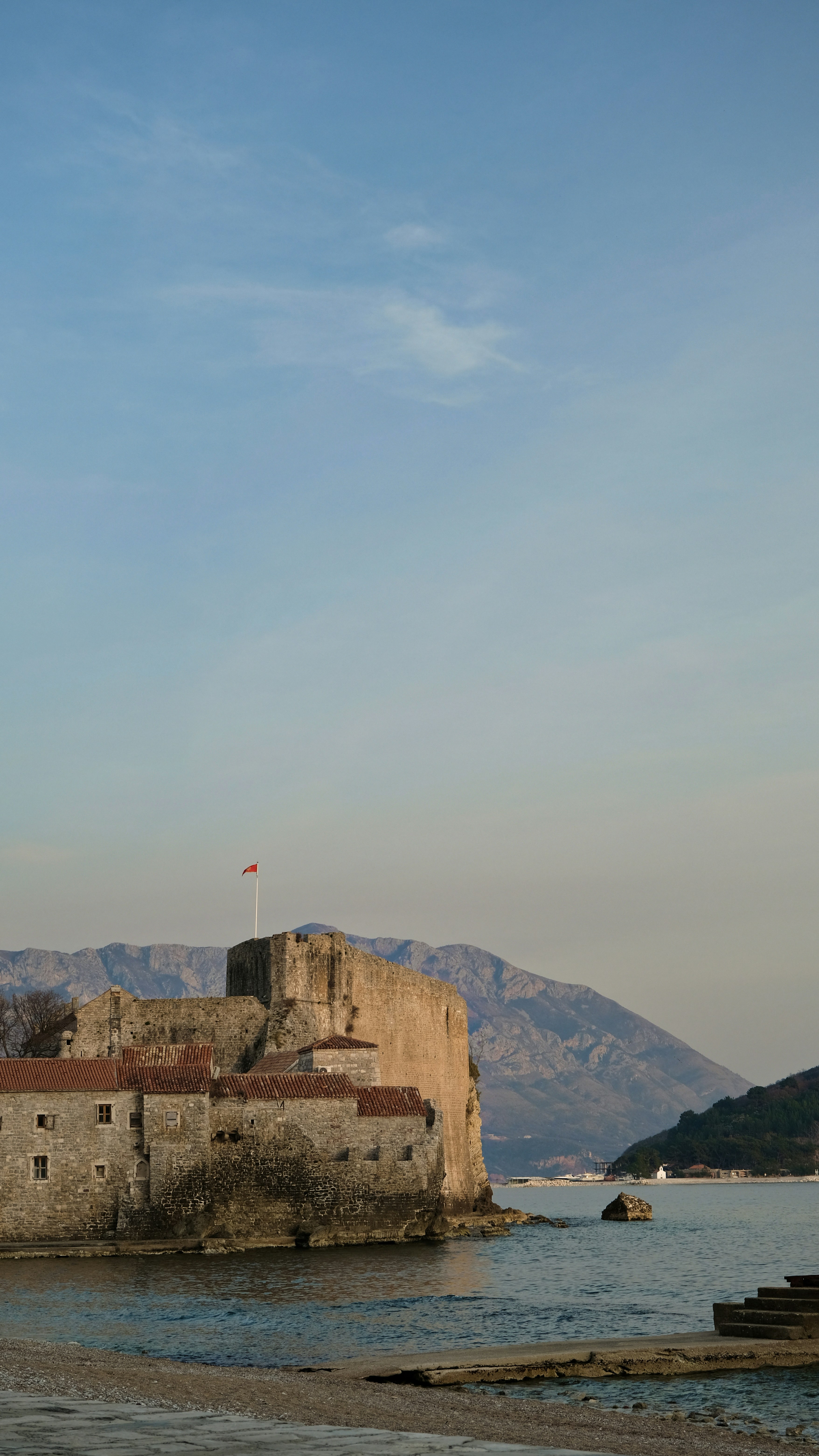 Flag-Topped Bastion at the Edge of Calm Waters