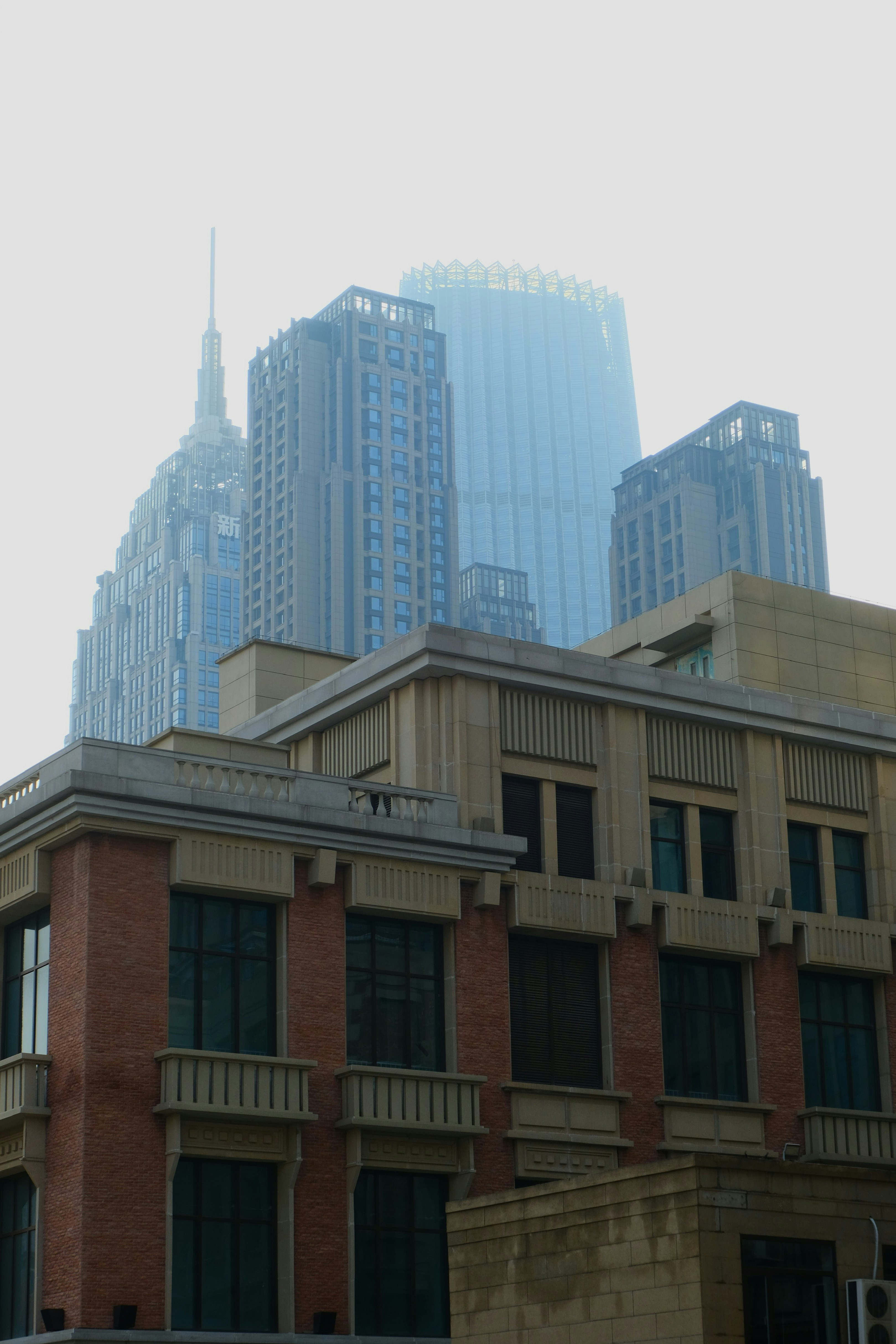 Brickwork in the Shadow of Glass Giants