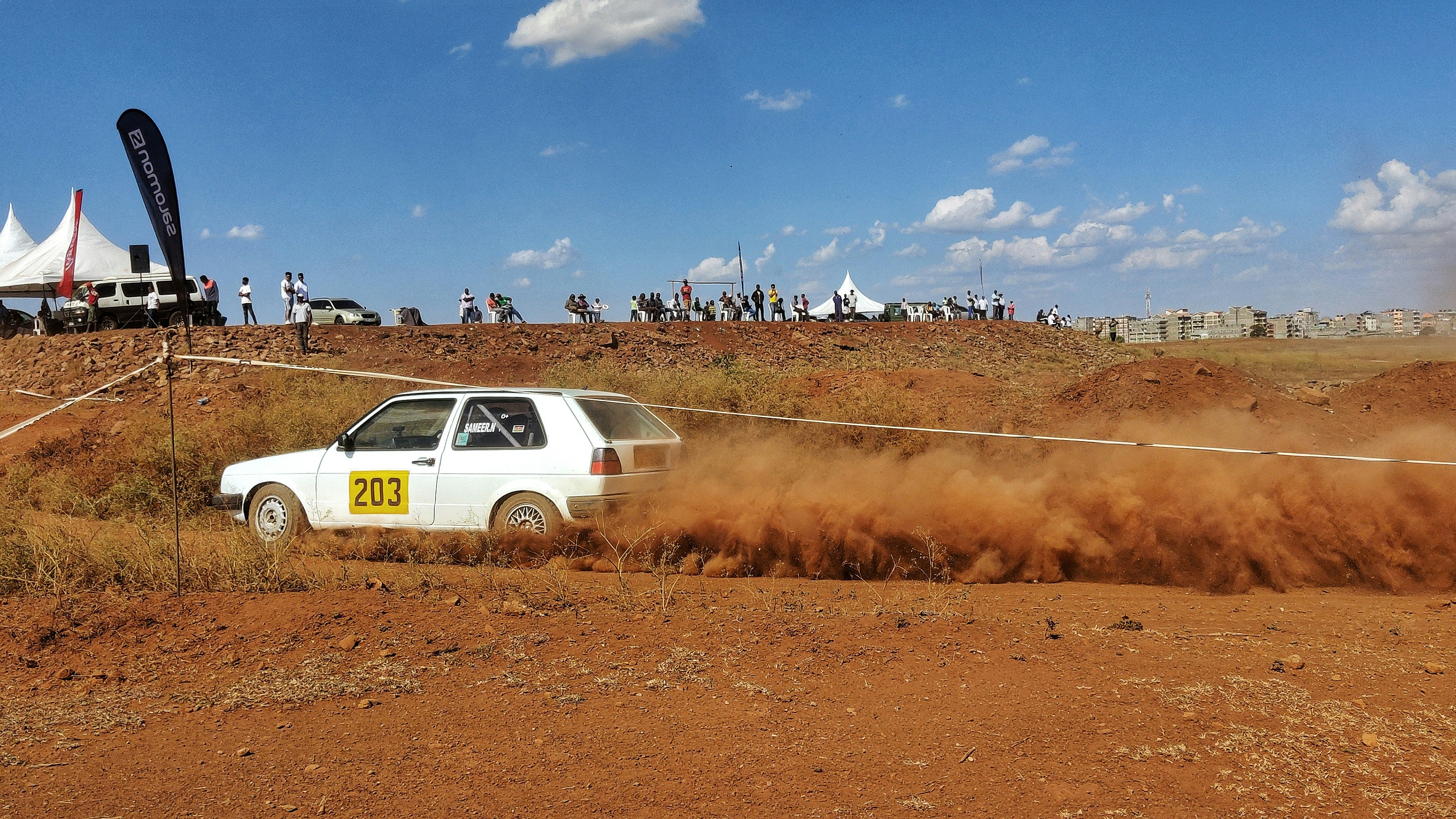 Dust and Thunder: A Rally Car Leaps Through a Desert Rally