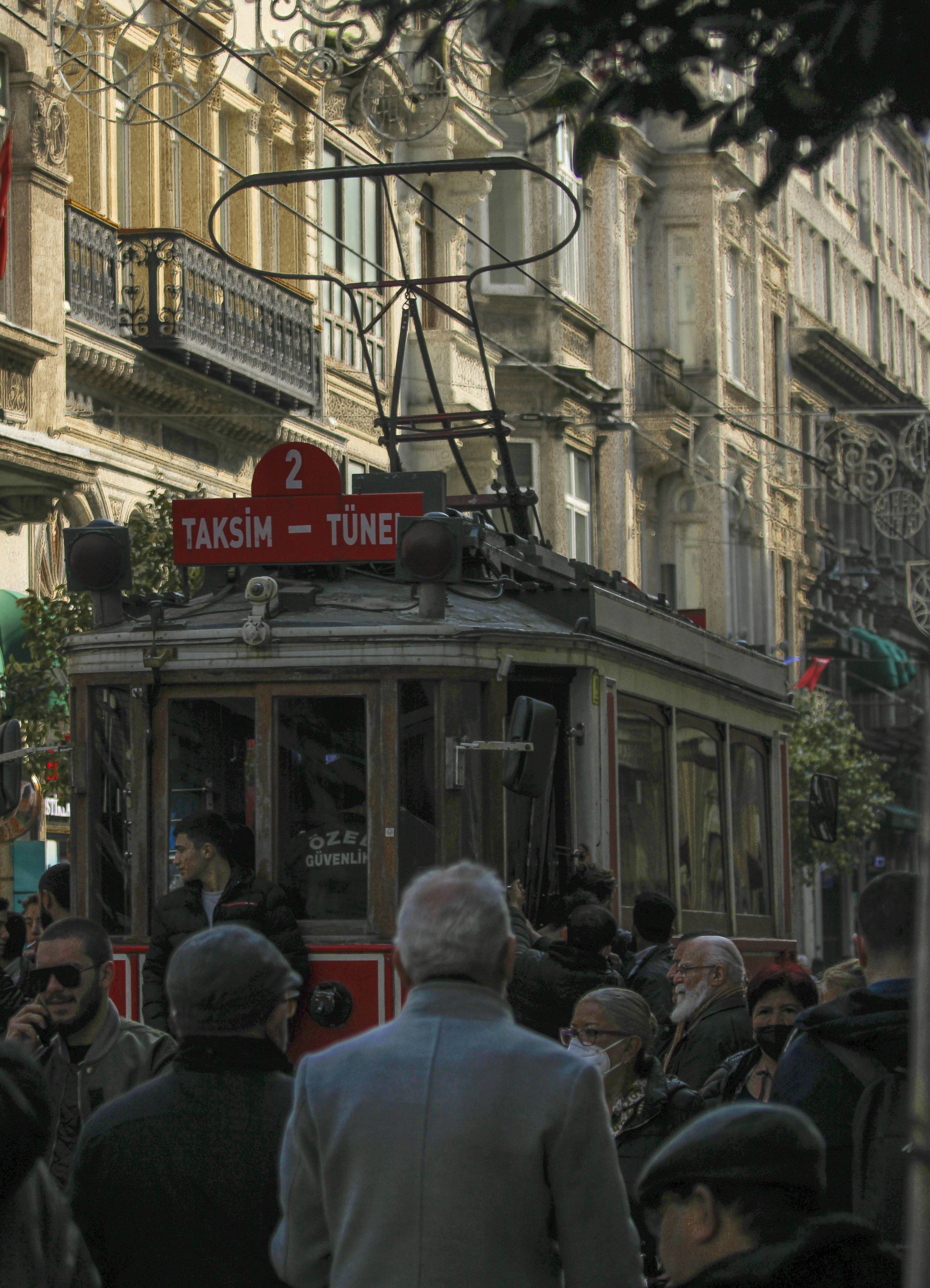 a crowd of people walking down a street